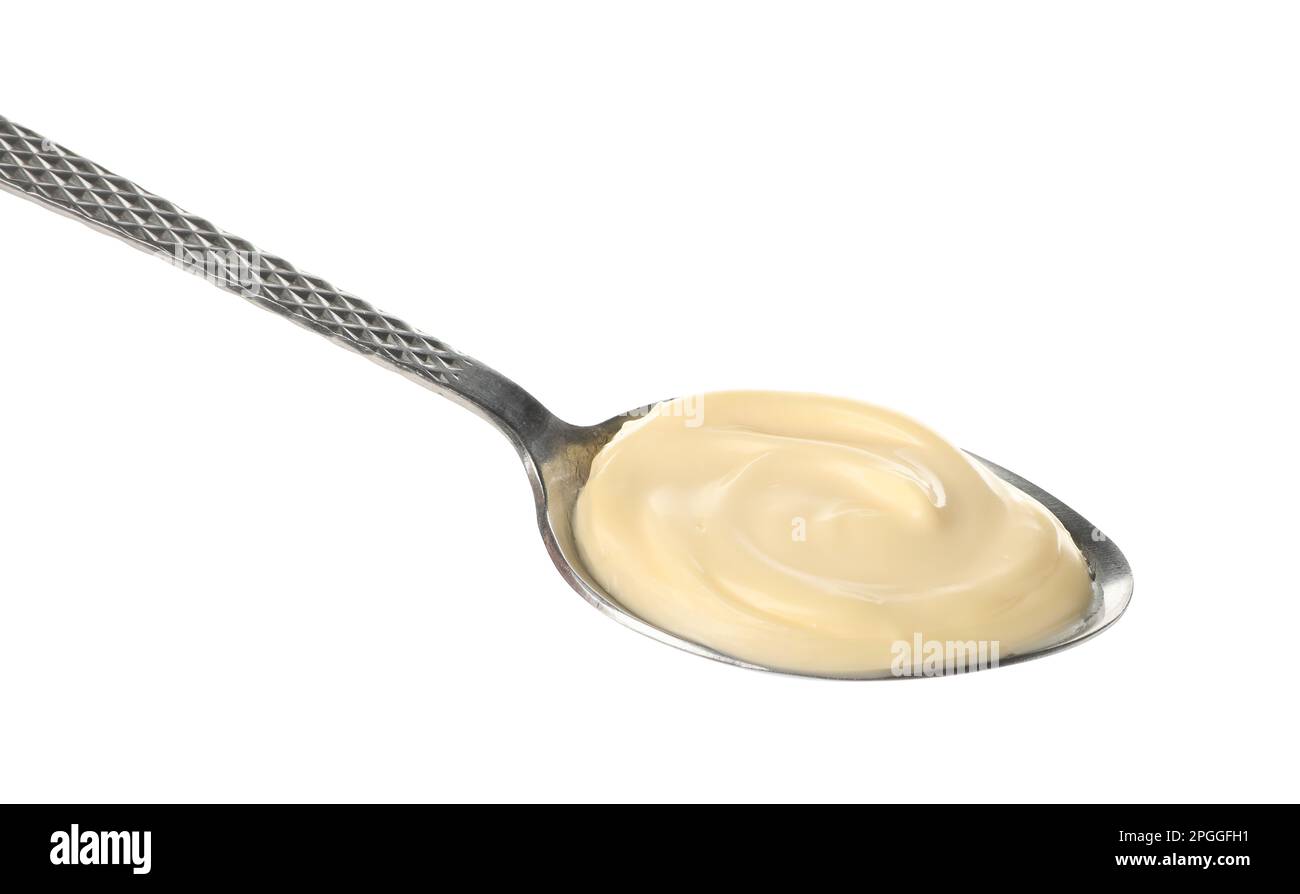 Spoon with tasty mayonnaise isolated on white Stock Photo - Alamy
