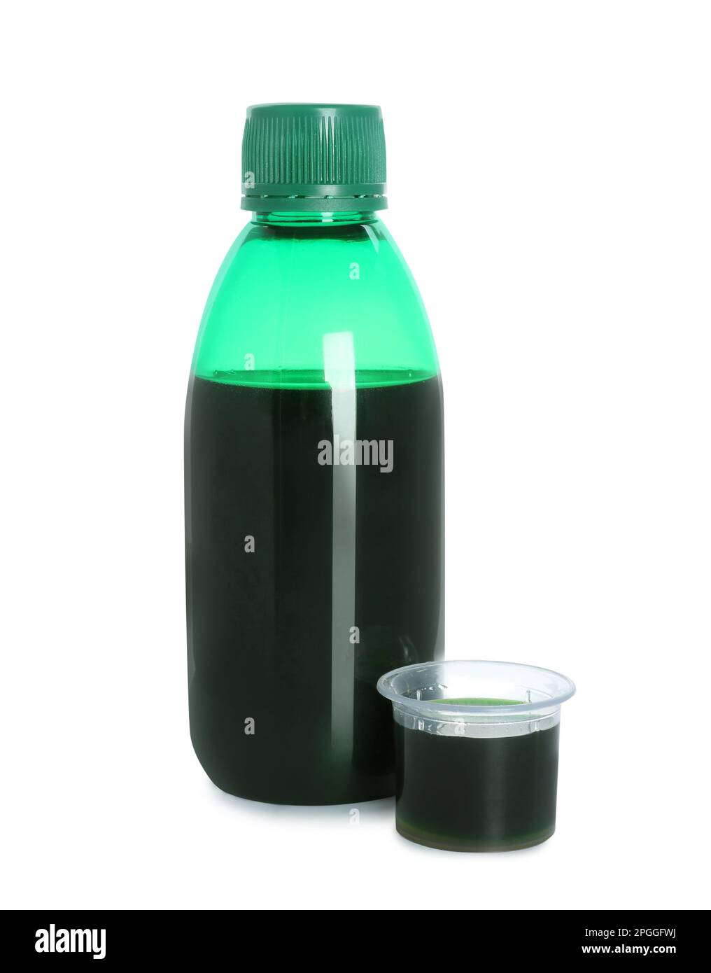 Bottle of cough syrup and measuring cup on white background Stock Photo ...