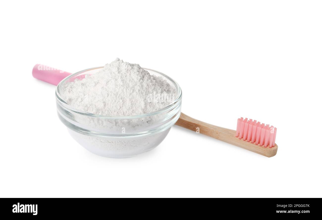 Glass bowl of tooth powder and brush on white background Stock Photo ...