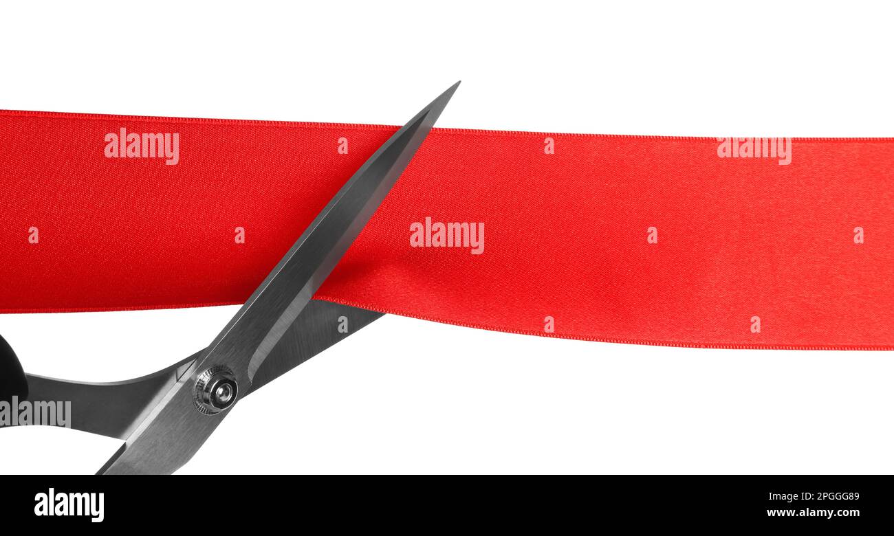 Cutting red ribbon with scissors on white background Stock Photo - Alamy