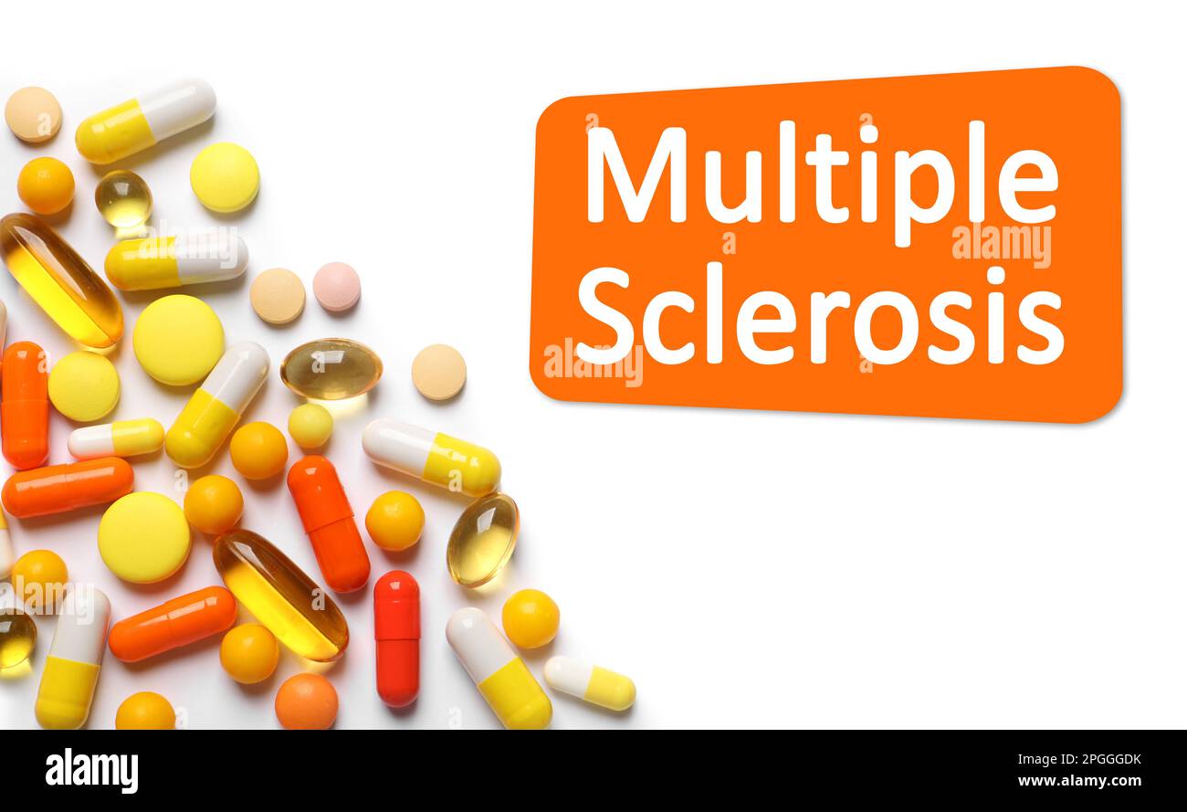 Multiple sclerosis treatment. Many different pills on white background ...