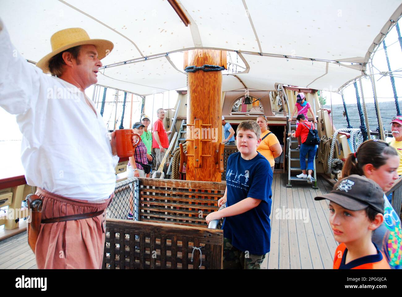 A reenactor teaches to a group of schoolchildren about life aboard the ...
