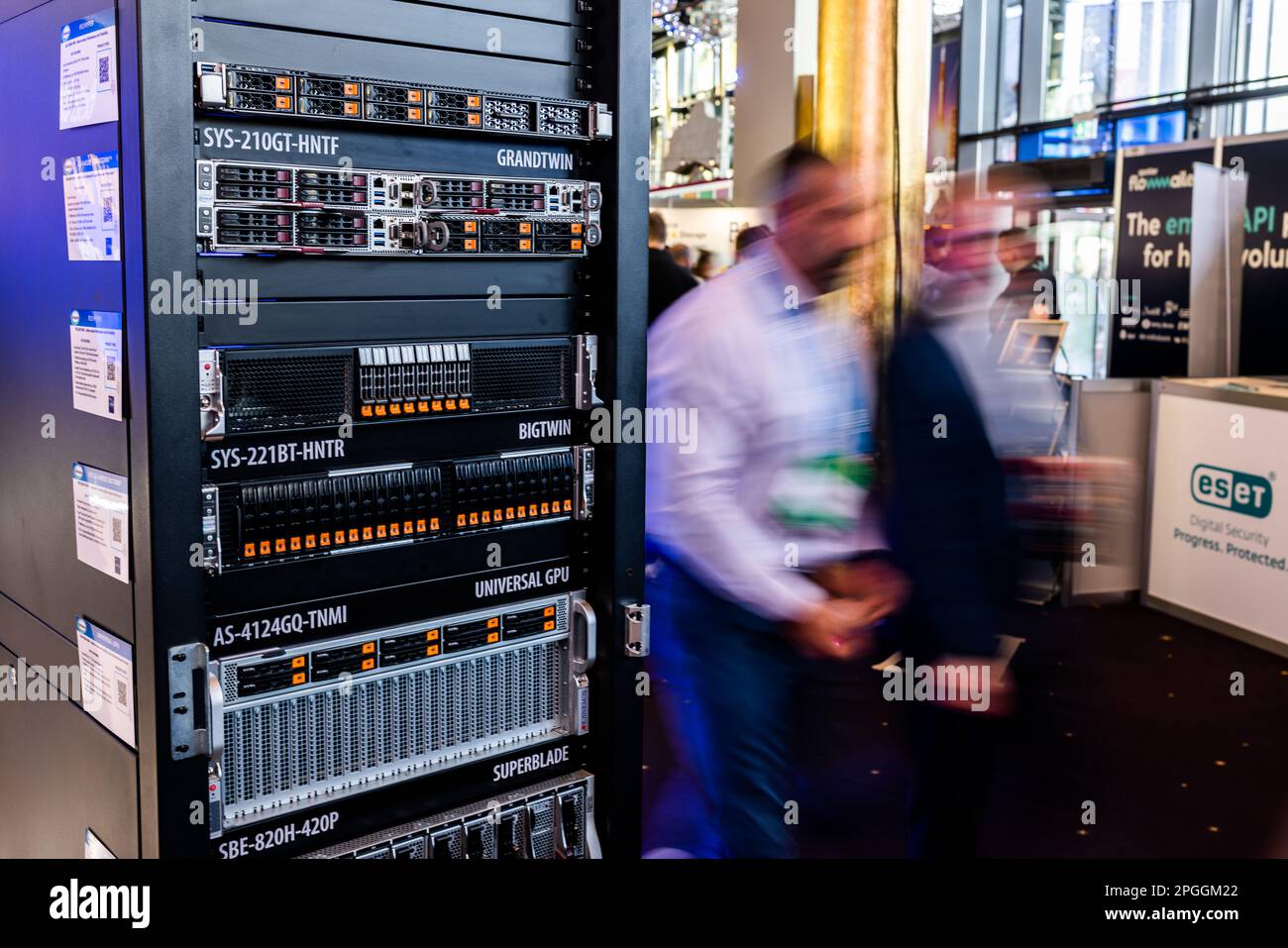 Rust, Germany. 22nd Mar, 2023. CloudFest attendees walk alongside a ...