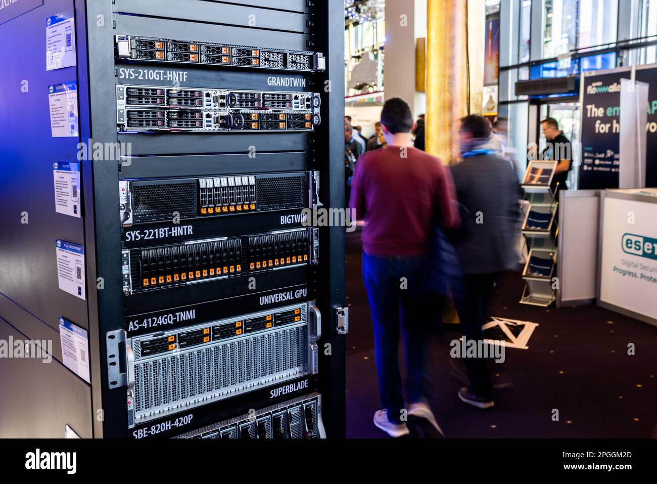 Rust, Germany. 22nd Mar, 2023. CloudFest attendees walk alongside a ...