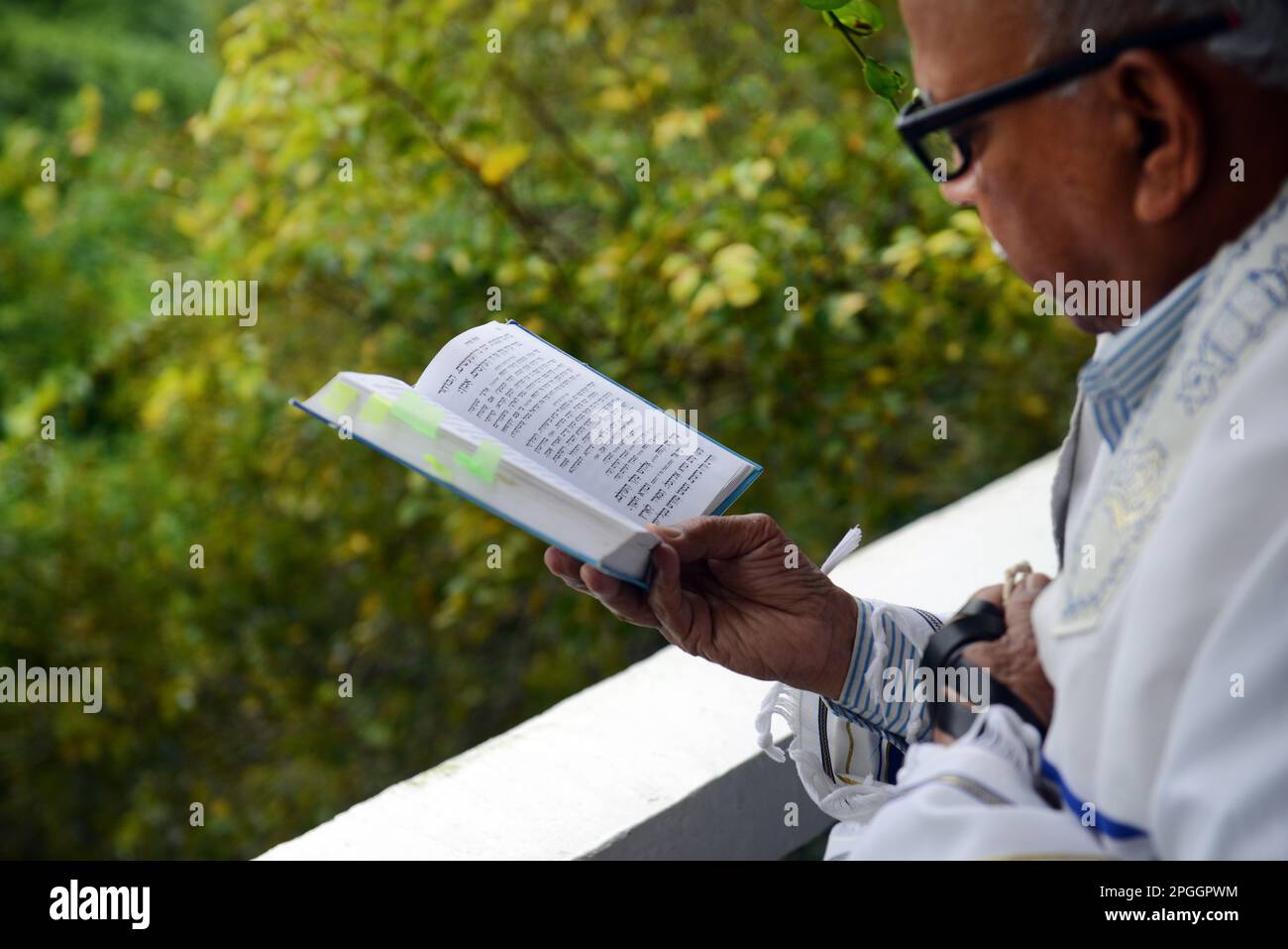 A Jewish man wearing Talit and Tefillin during Shacharit ( morning ...