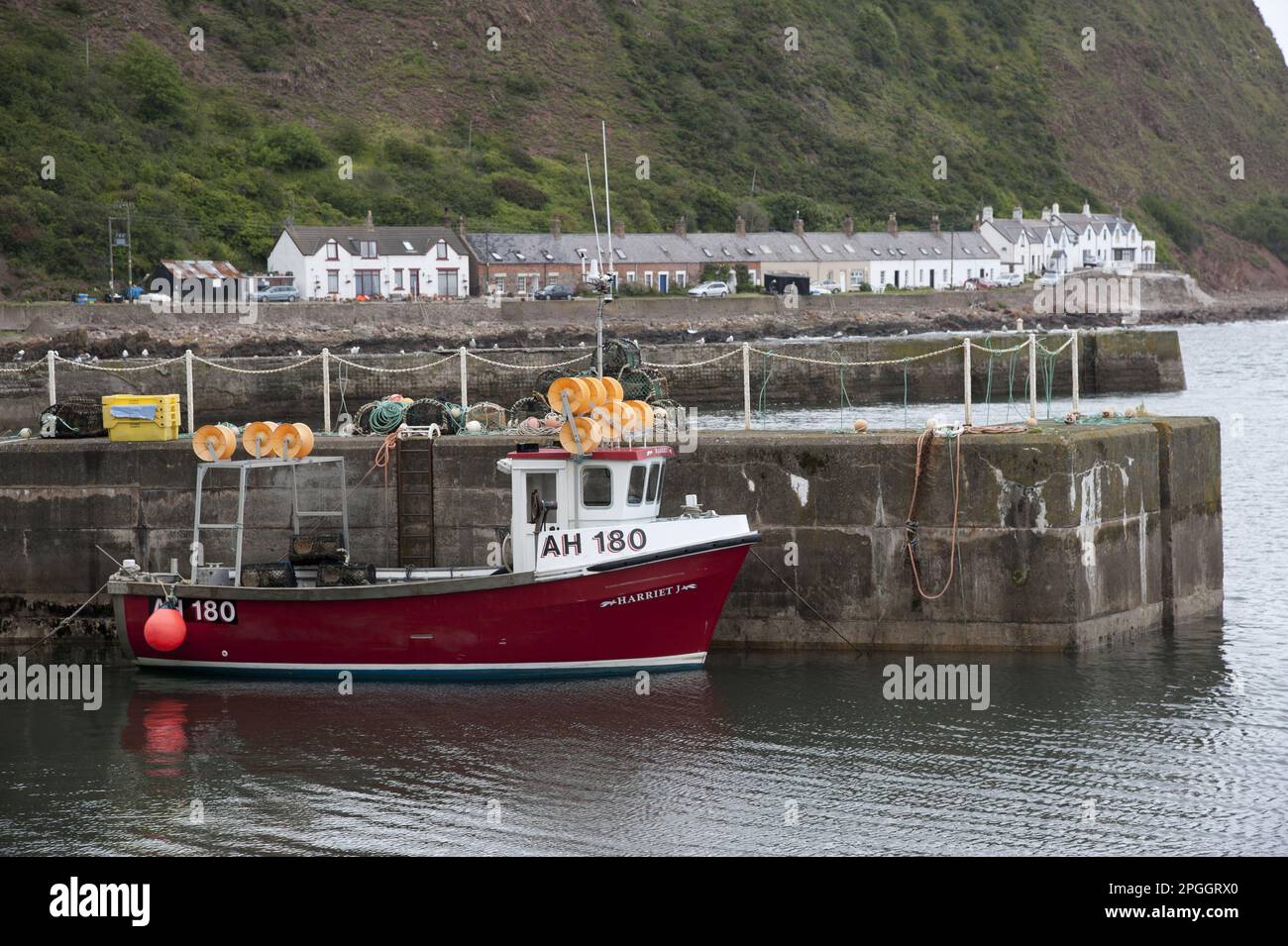 Lobster fishing boat at harbour of fishing village Burnmouth, Scottish ...