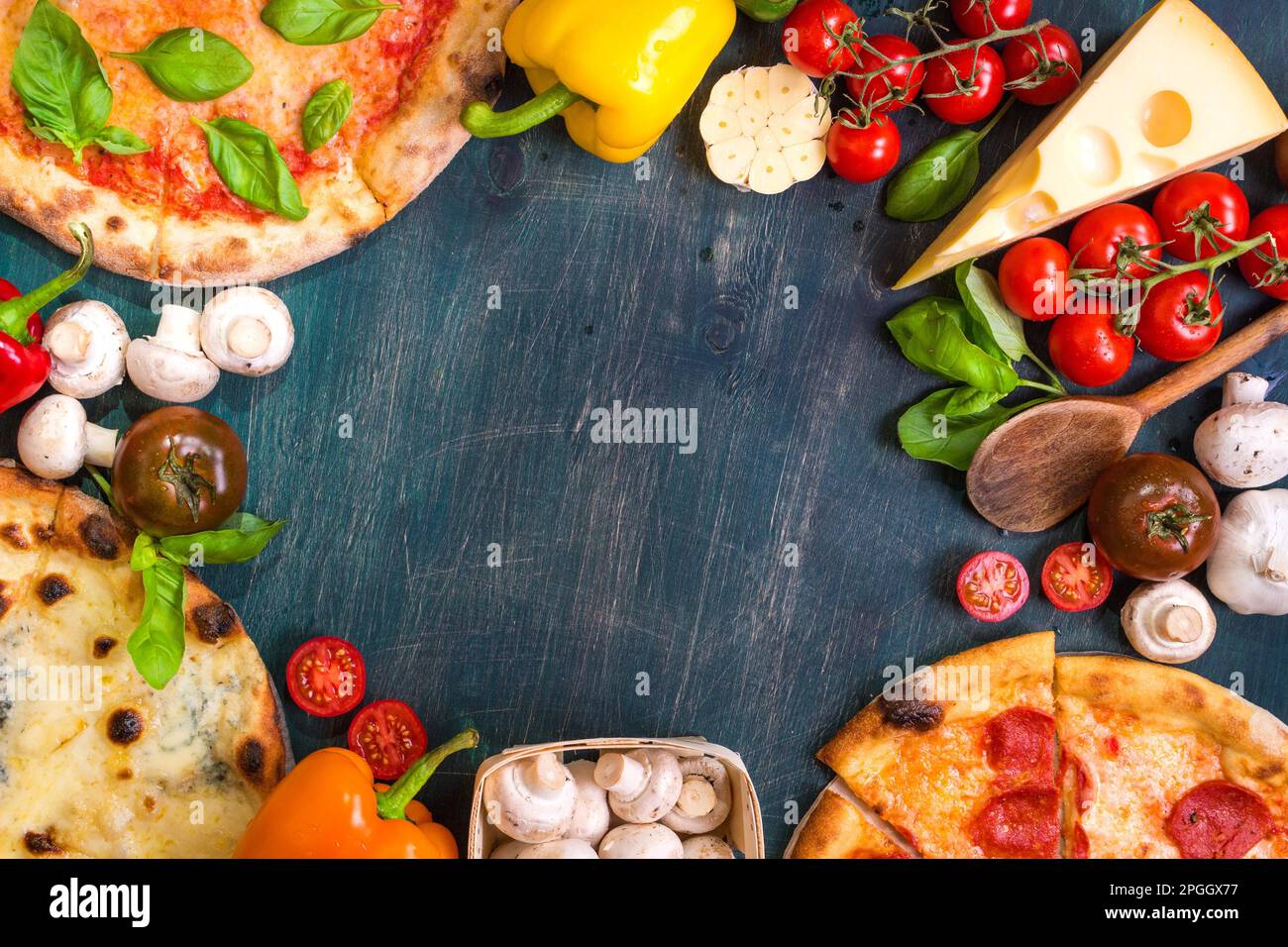 Pizza with assorted toppings and ingredients background. Space for text ...
