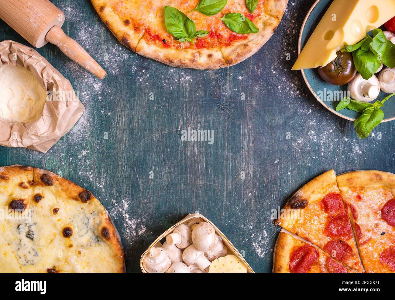 Pizza with assorted toppings and ingredients background. Space for text ...