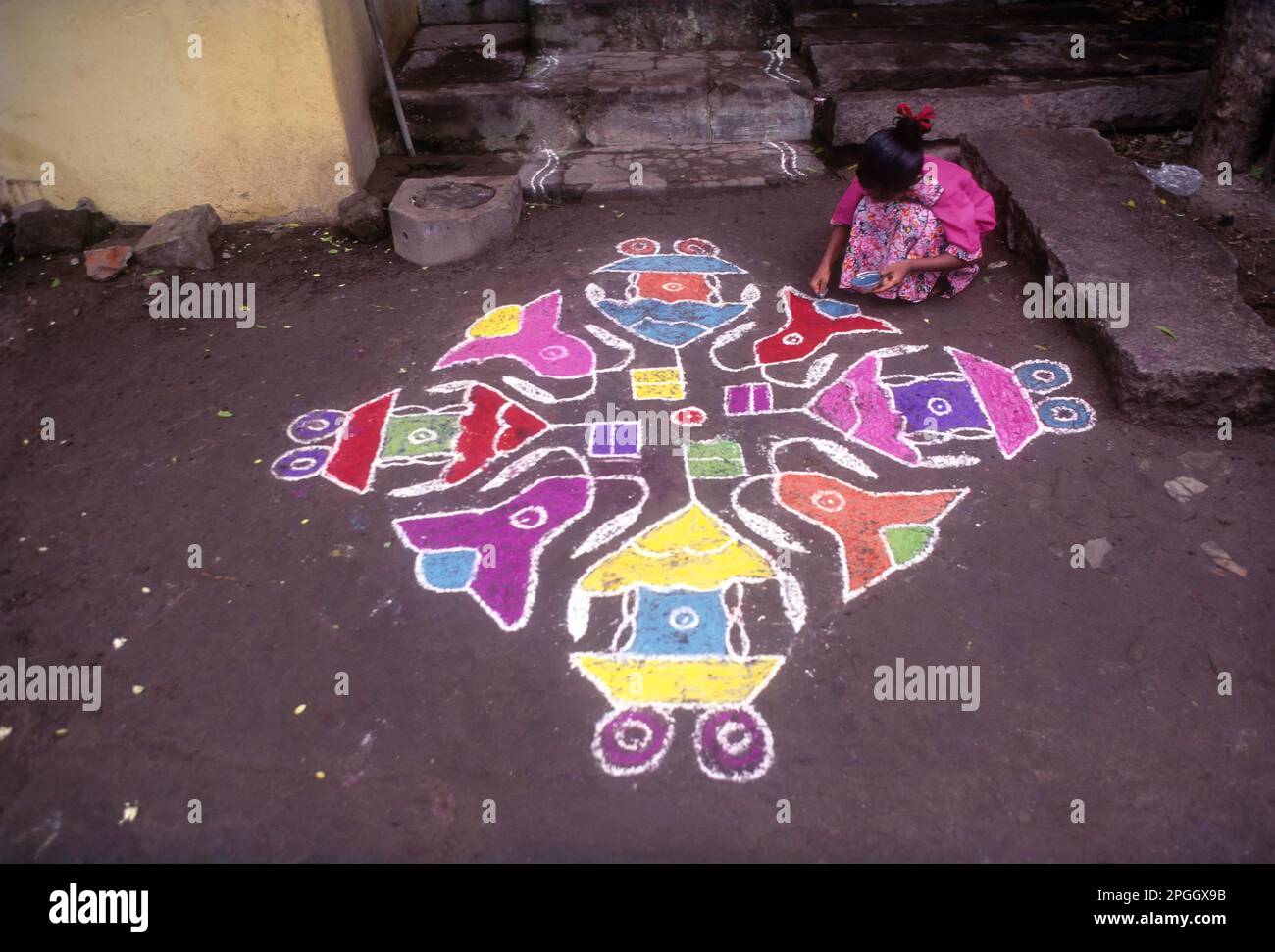 Kolam or Rangoli, a Hindu girl learns it as a child's play at her young ...