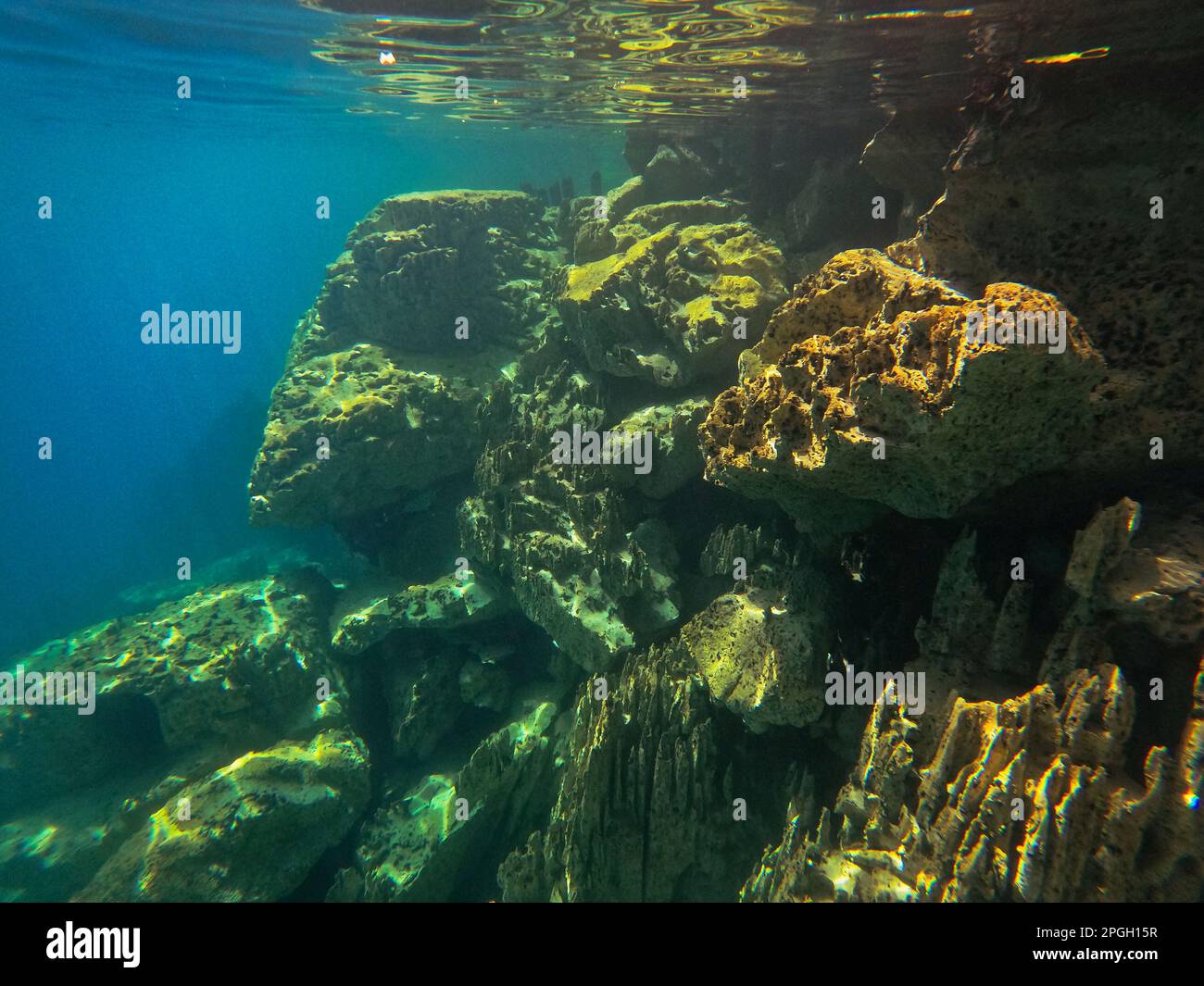 A rough rock below the water in Coron, Palawan in the Philippines with ...
