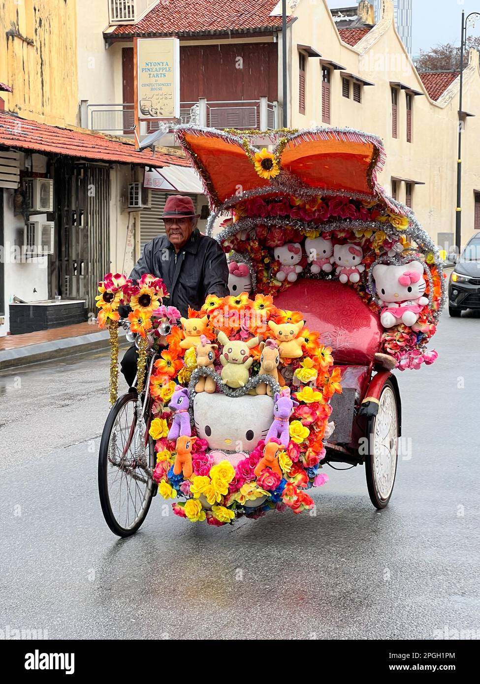 Malakka, Malaysia. 05th Mar, 2023. A rickshaw driver drives his pimped ...