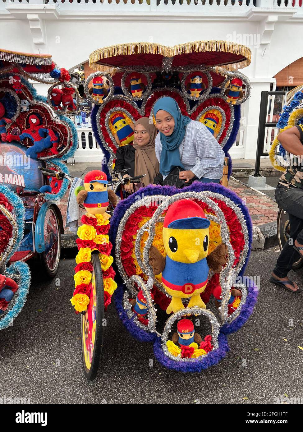 Malakka, Malaysia. 05th Mar, 2023. Female tourists board a cycle ...