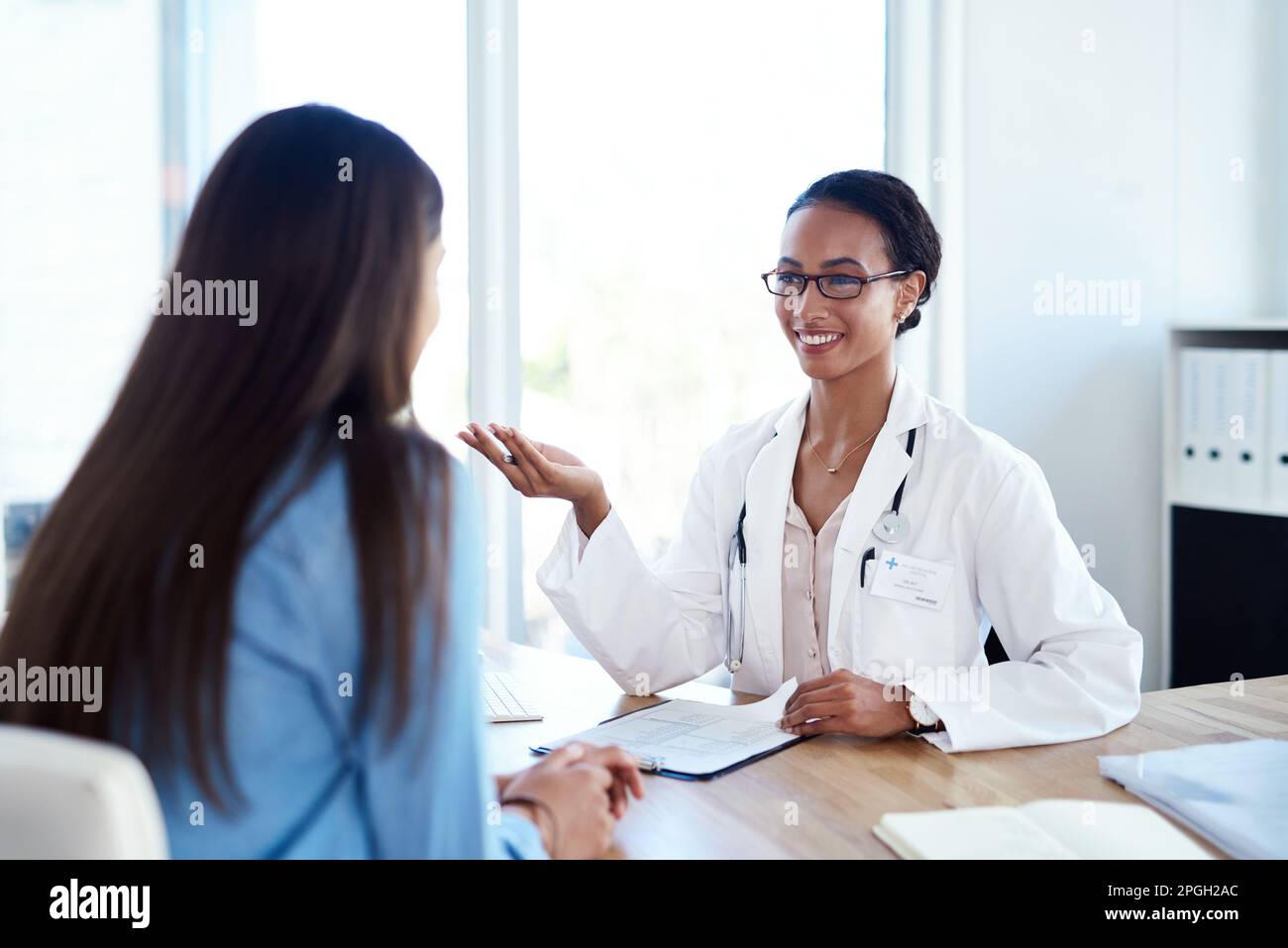 Doctor visits arent all doom and gloom. a young doctor having a ...
