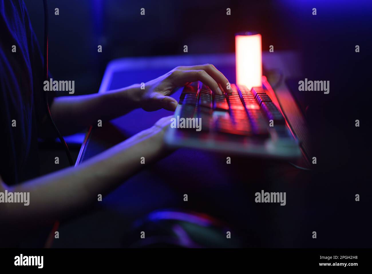 Hand of female cyber hacker gamer pressing on keyboard to competition ...