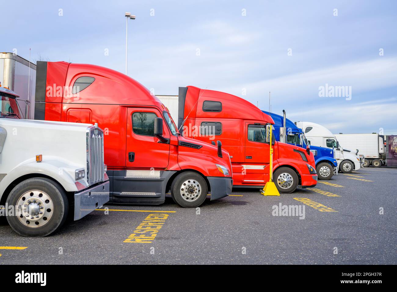 Industrial big rigs semi truck tractors with loaded semi trailers ...