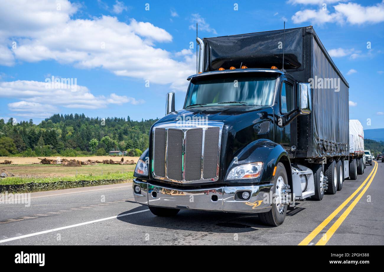 Industrial shiny black day cab professional big rig semi truck tractor ...