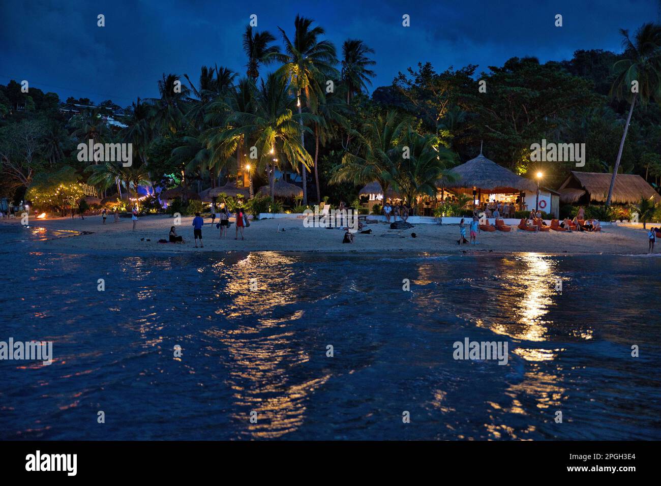 Sandy beach of El Nideo, Palawan in the Philippines at night, with ...