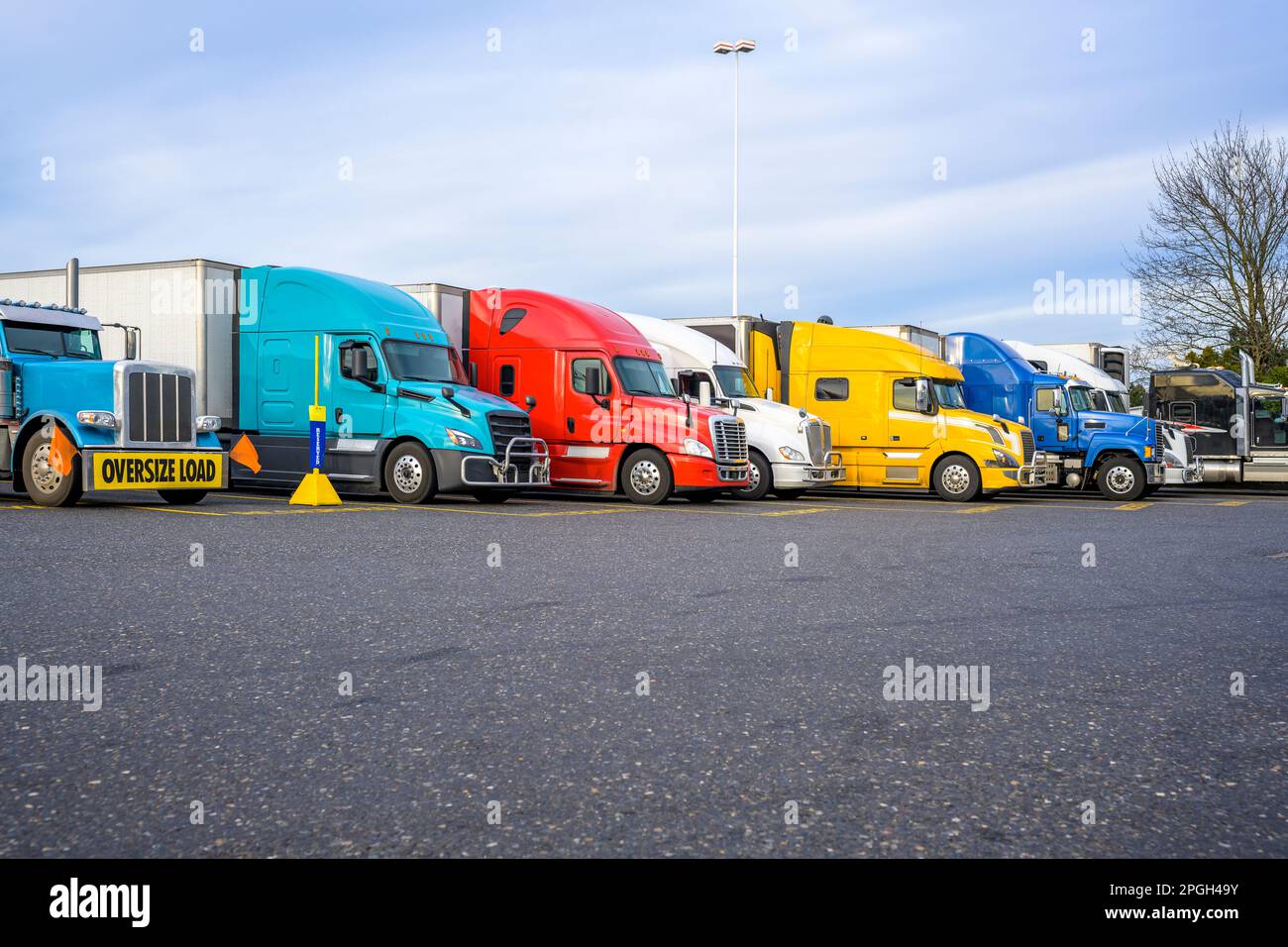 Industrial big rigs semi truck tractors with loaded semi trailers ...
