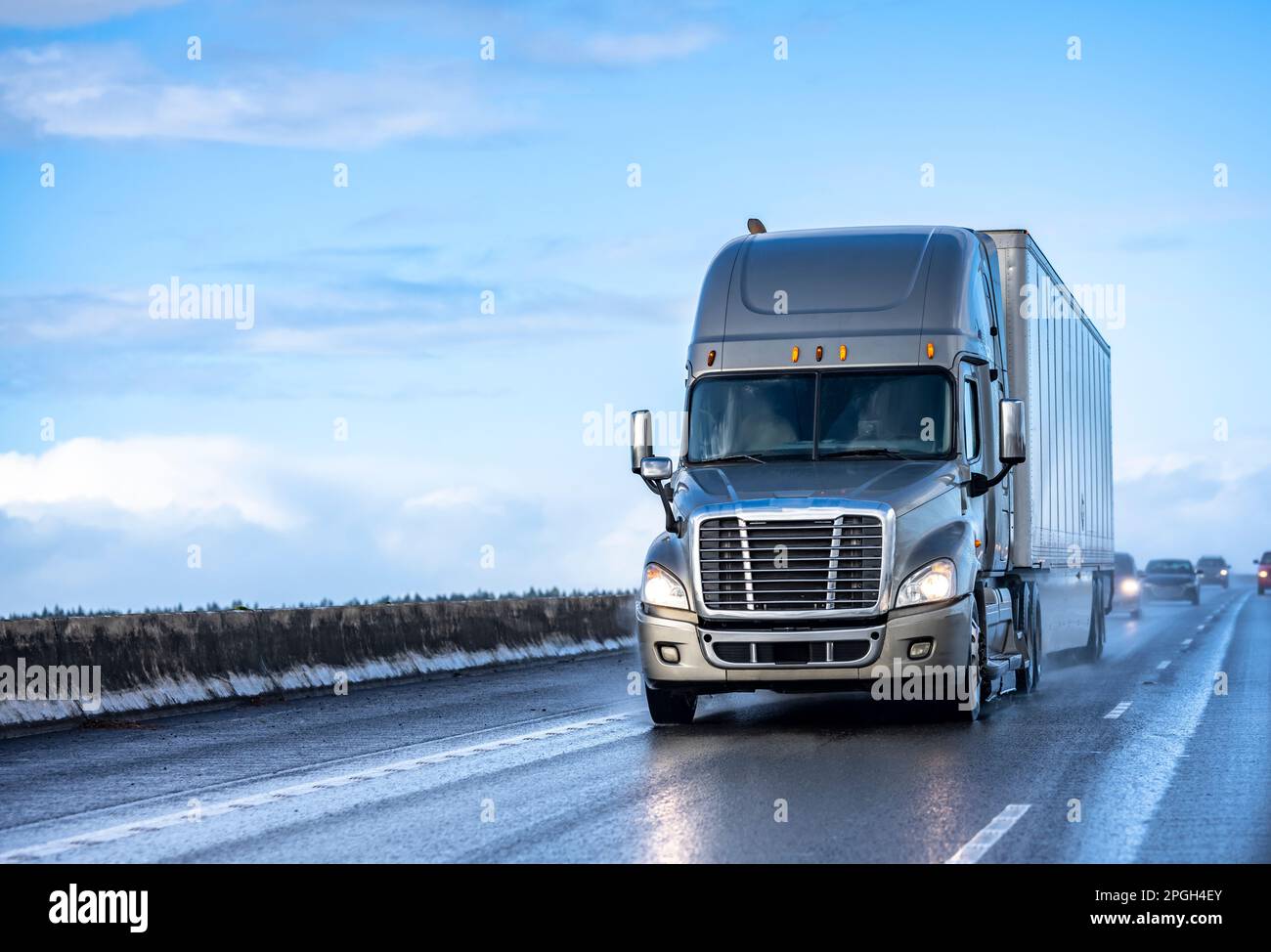 Industrial long hauler big rig gray semi truck tractor with extended ...