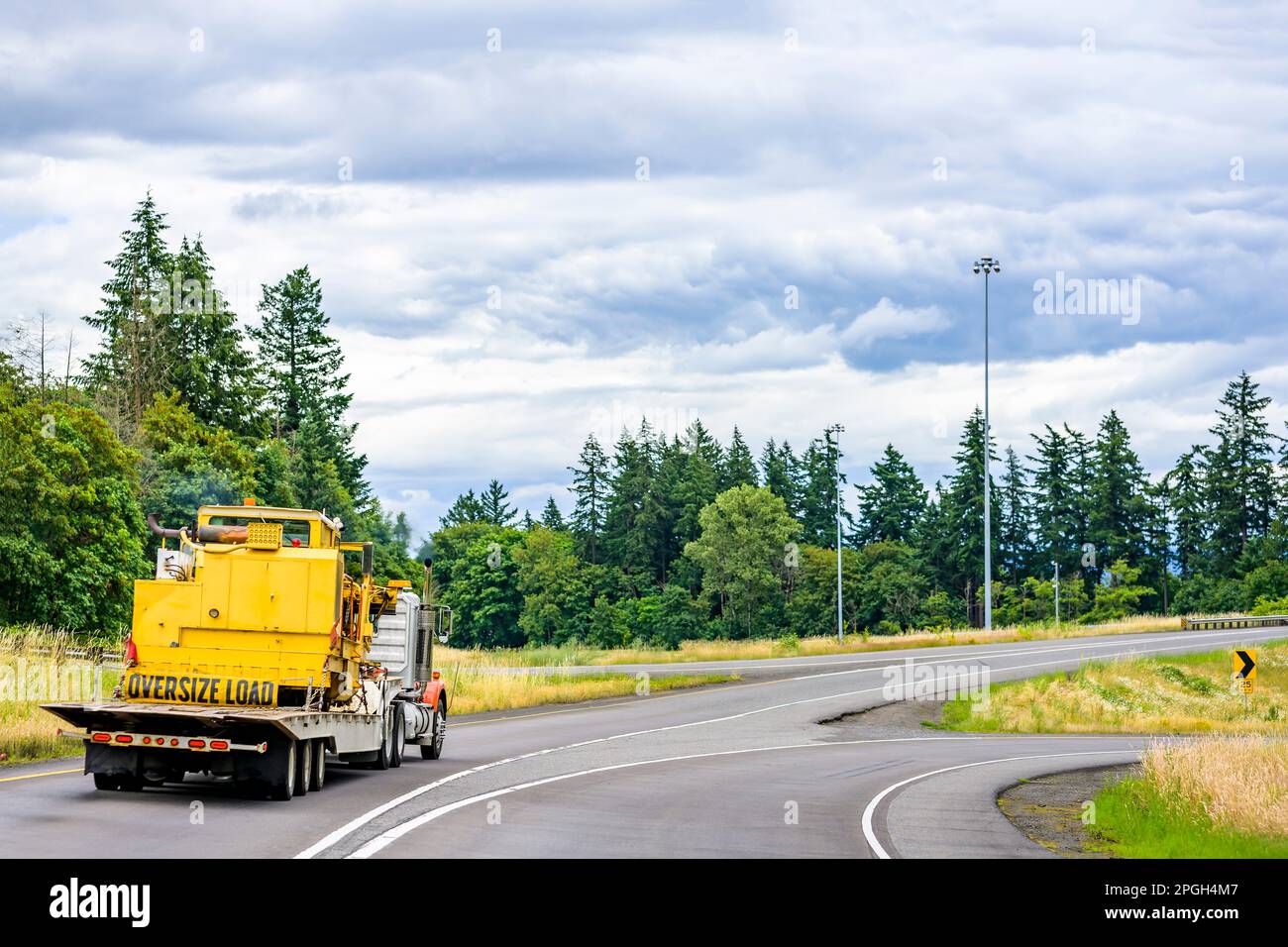 Big rig classic powerful semi truck tractor with oversize load sign on ...