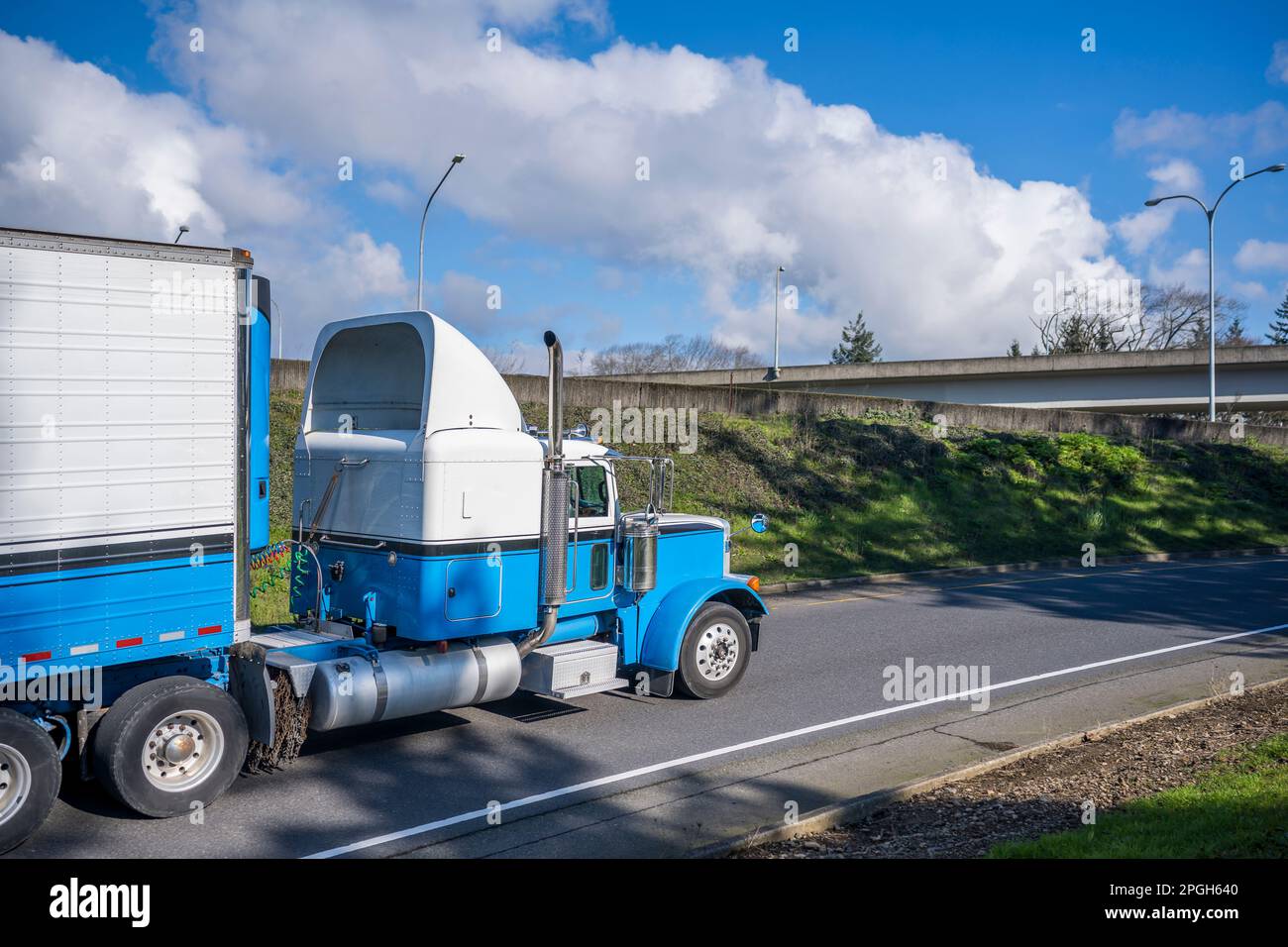 Classic American industrial bonnet white and blue big rig semi truck ...