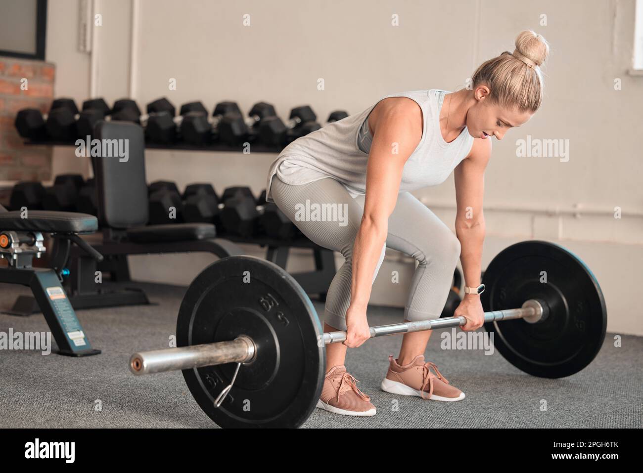 Fitness, weightlifting and a woman bodybuilder in the gym for a workout ...