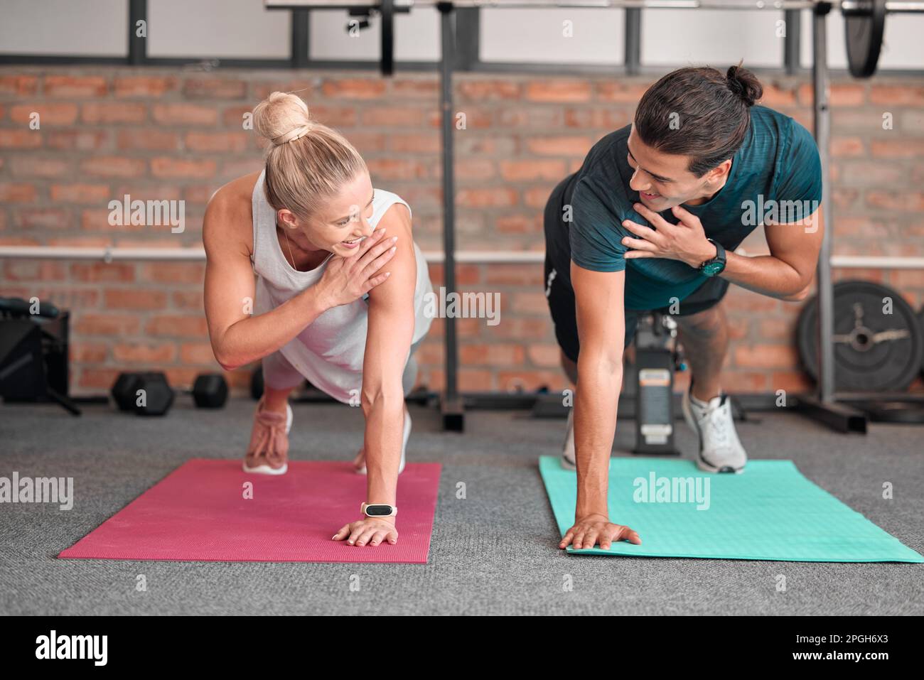 Fitness, push up and woman with partner, personal trainer or gym coach ...