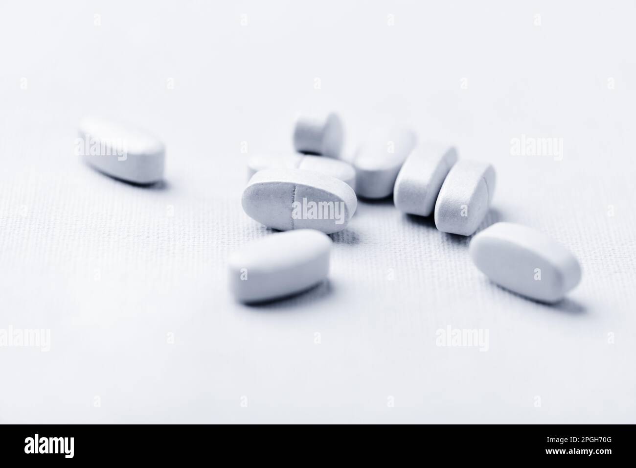 Vitamin C tablets on bright paper background. Soft focus. Copy space ...