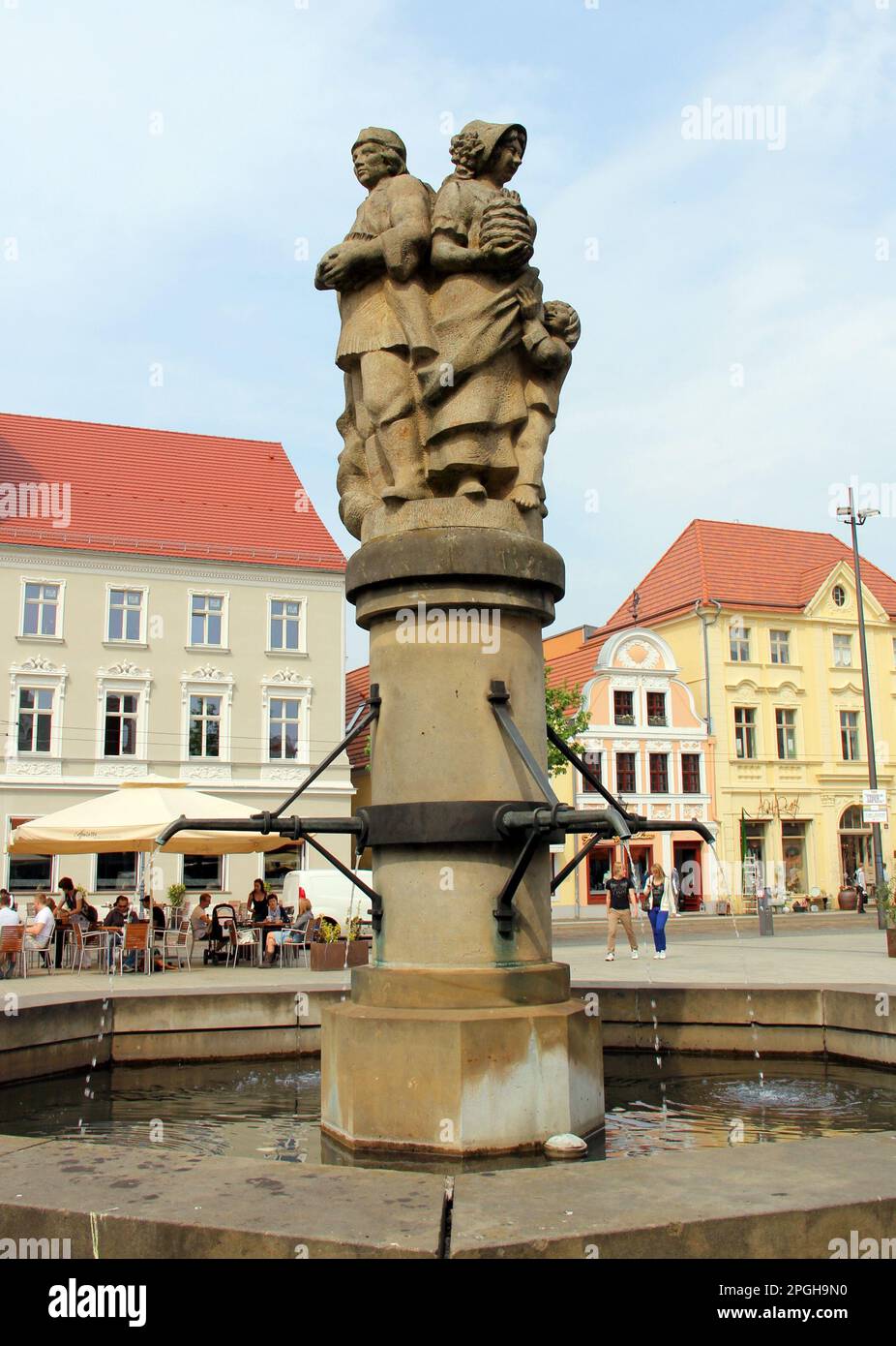 Sculptures topping the water fountain at the Old Market Square ...