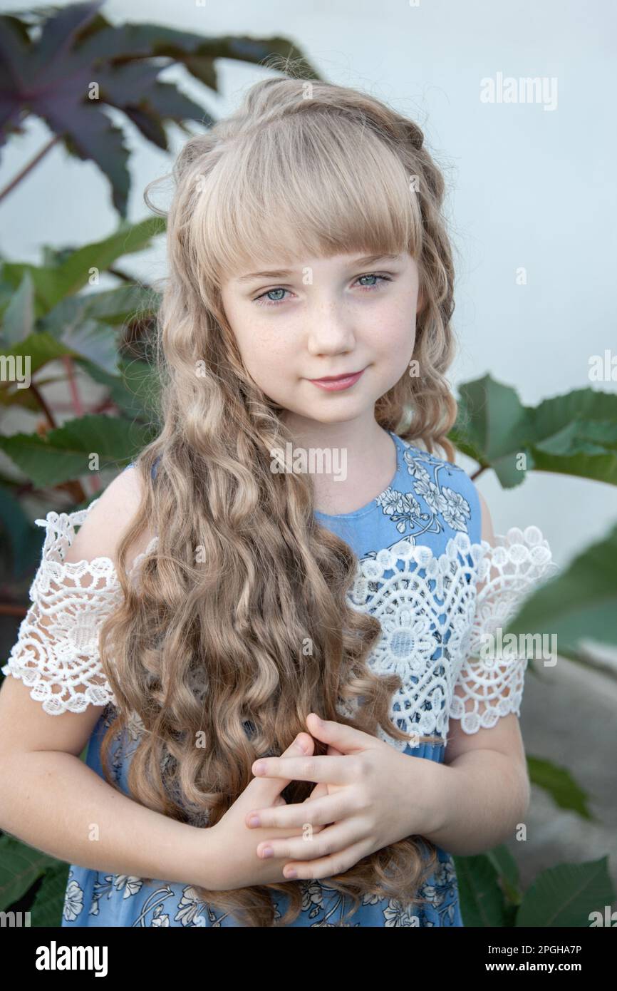 Portrait Of A Girl With Long Blonde Hair On The Street A 9 11 Year Old