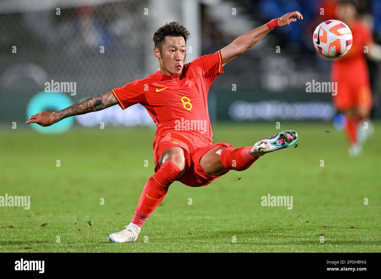 Xin Xu of China kicks at the ball during their friendly soccer match ...