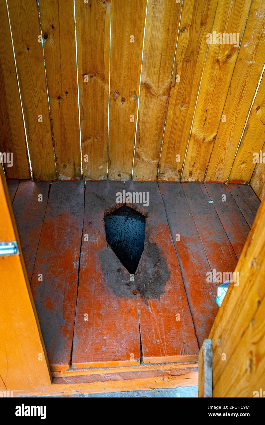 Old fashioned wooded outhouse toilet with a hole Stock Photo - Alamy