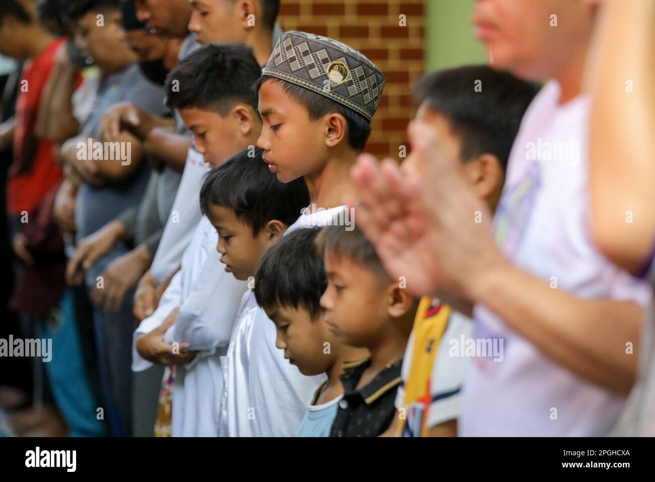 March 23, 2023: Filipino Muslims pray inside a mosque as they attend a ...