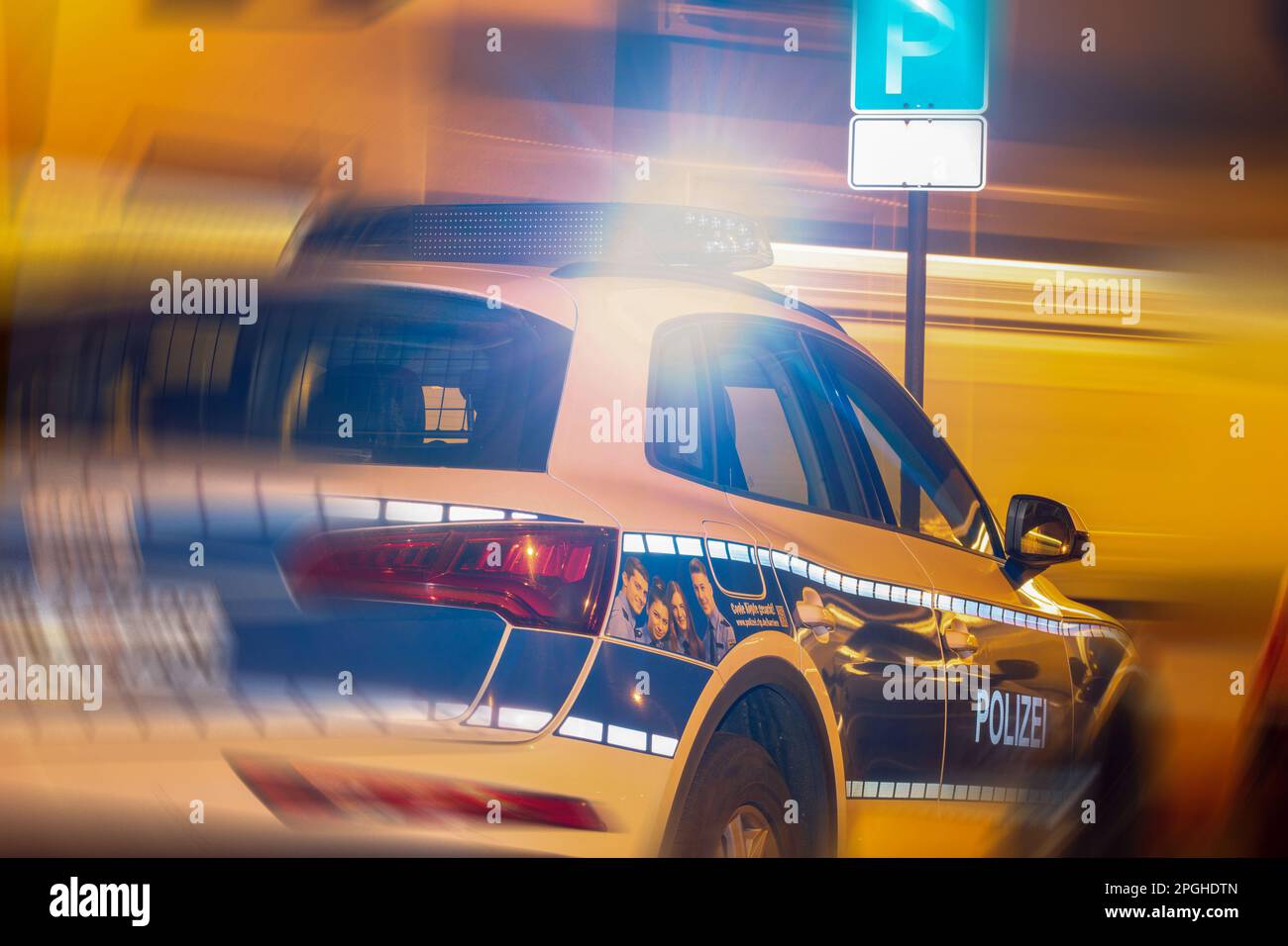 Symbol image of police action: Police car in darkness Stock Photo - Alamy