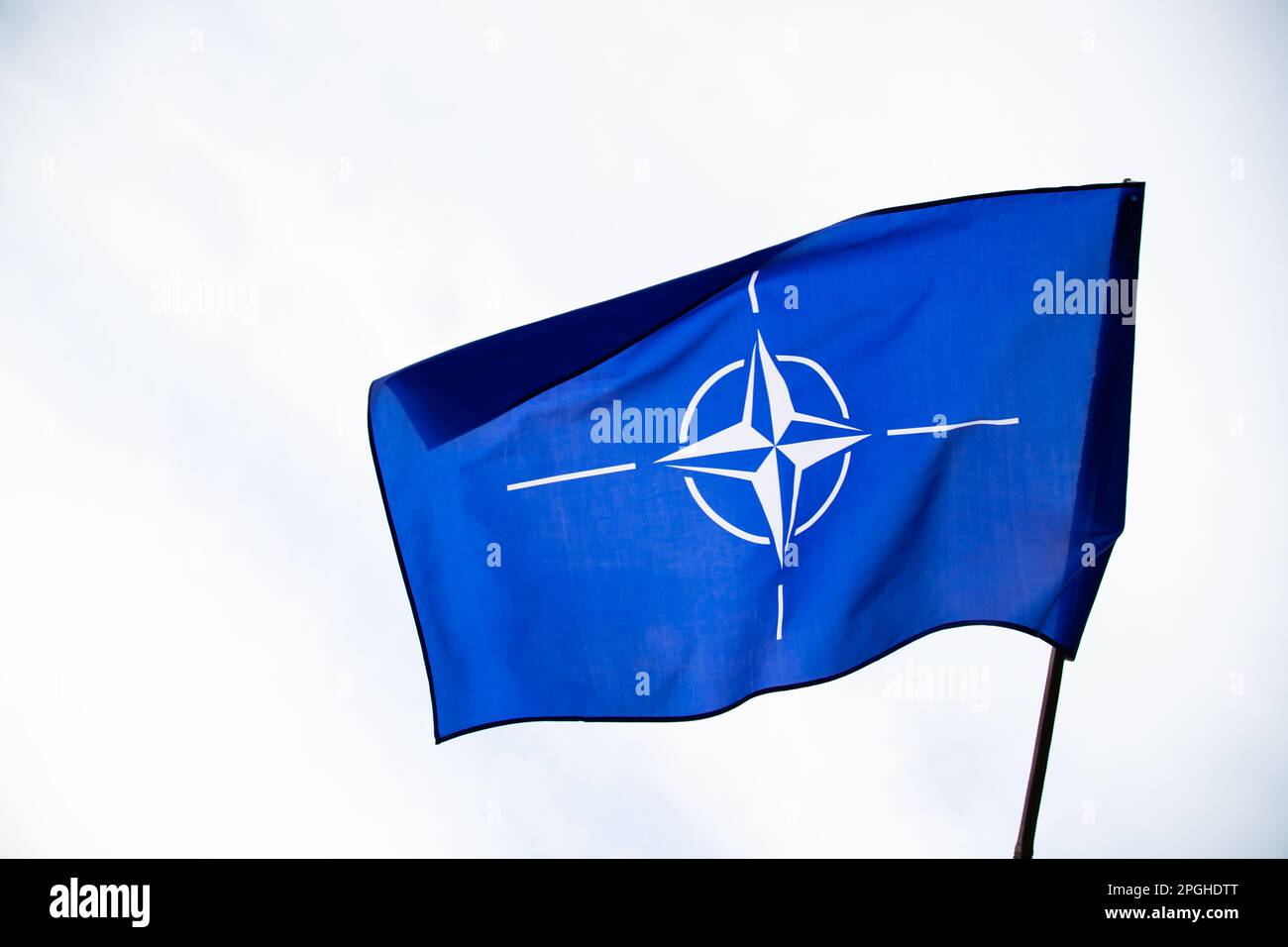 NATO (North Atlantic Treaty Organization) flag waving. NATO is an ...