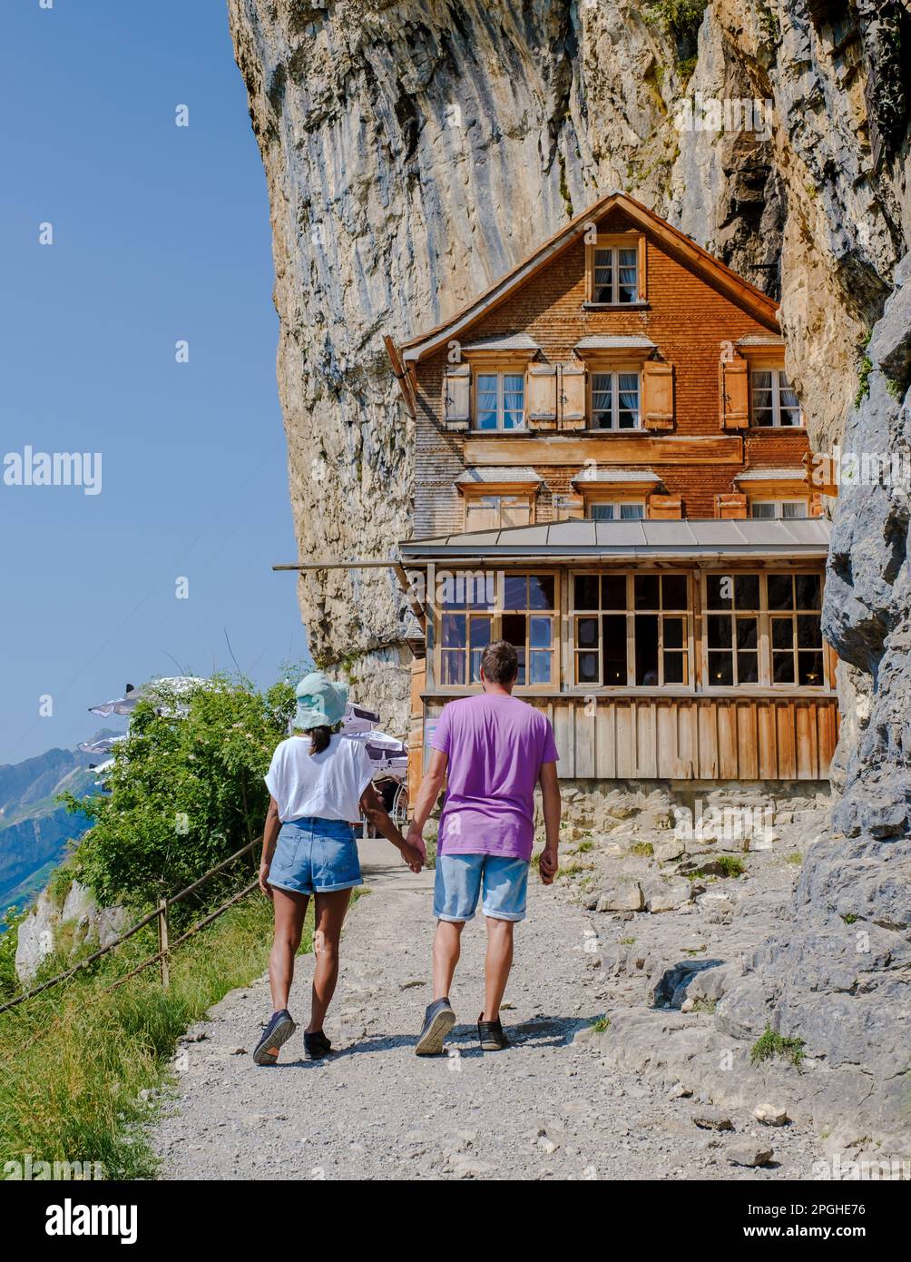 Couple of men and women hiking to Berggasthaus Aescher in den ...