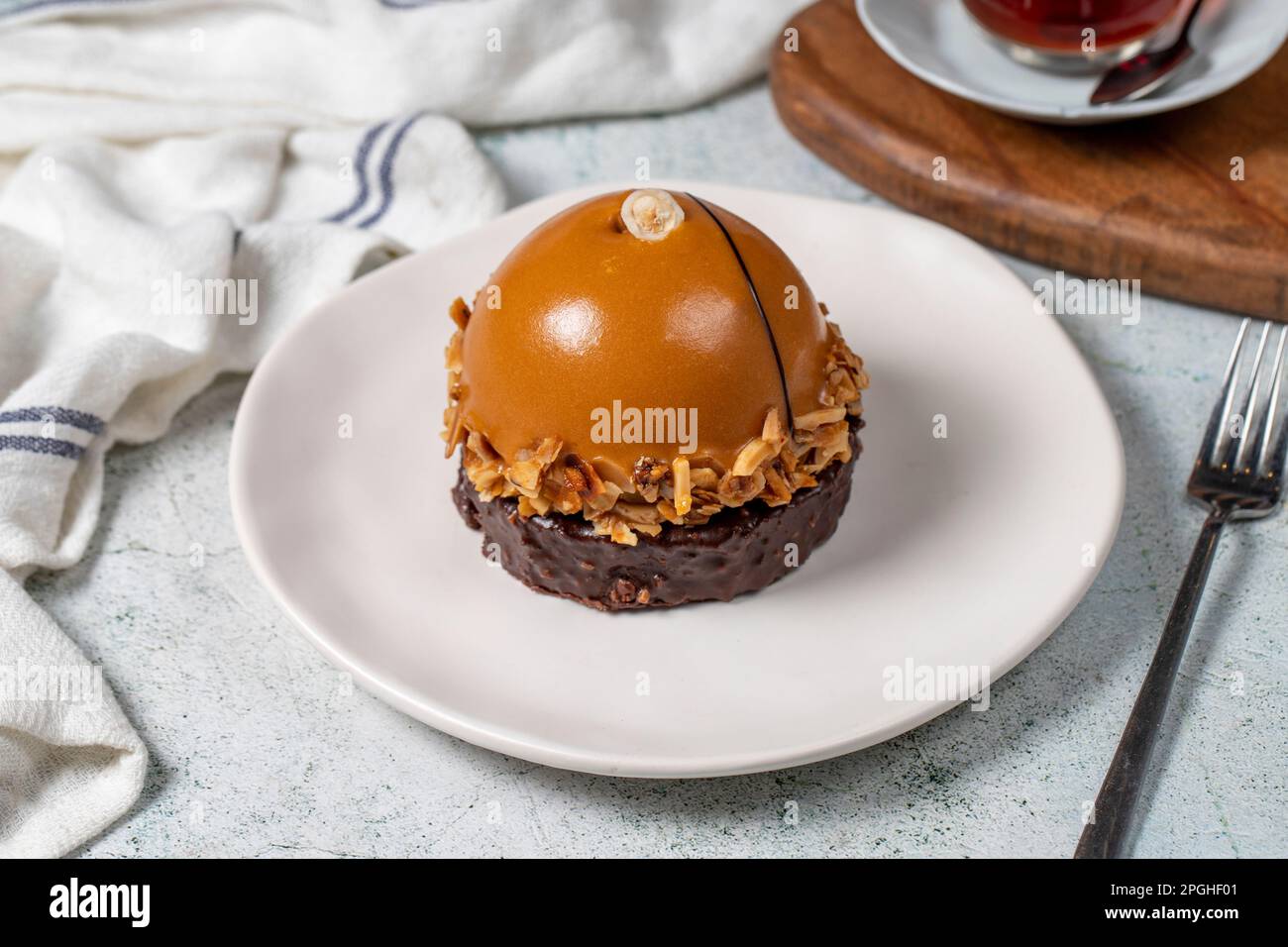 Round caramel cake. Hazelnut and cream portion cake Stock Photo - Alamy