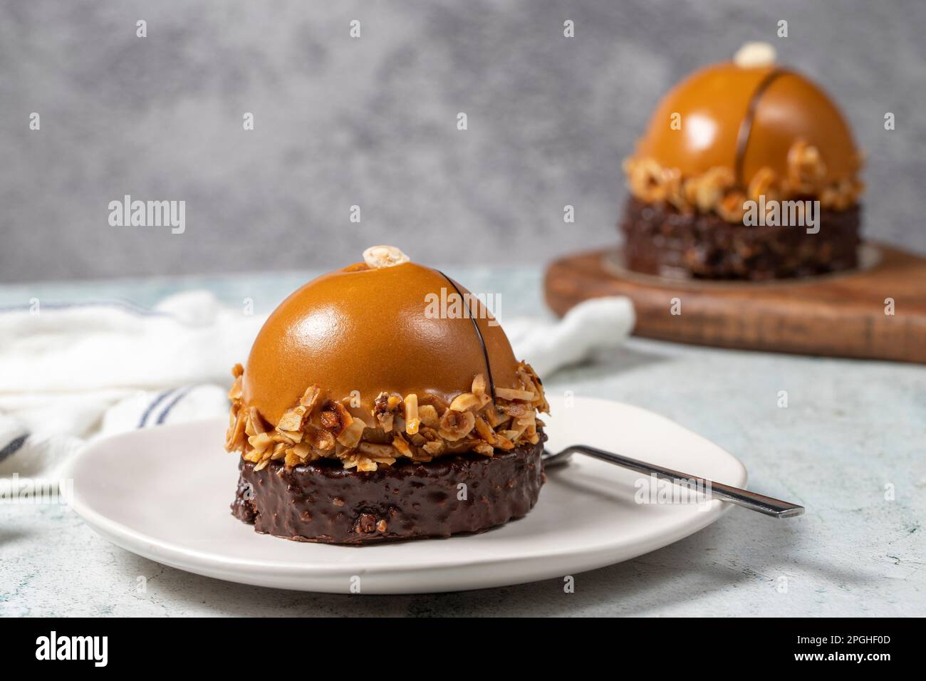 Round caramel cake. Hazelnut and cream portion cake Stock Photo - Alamy