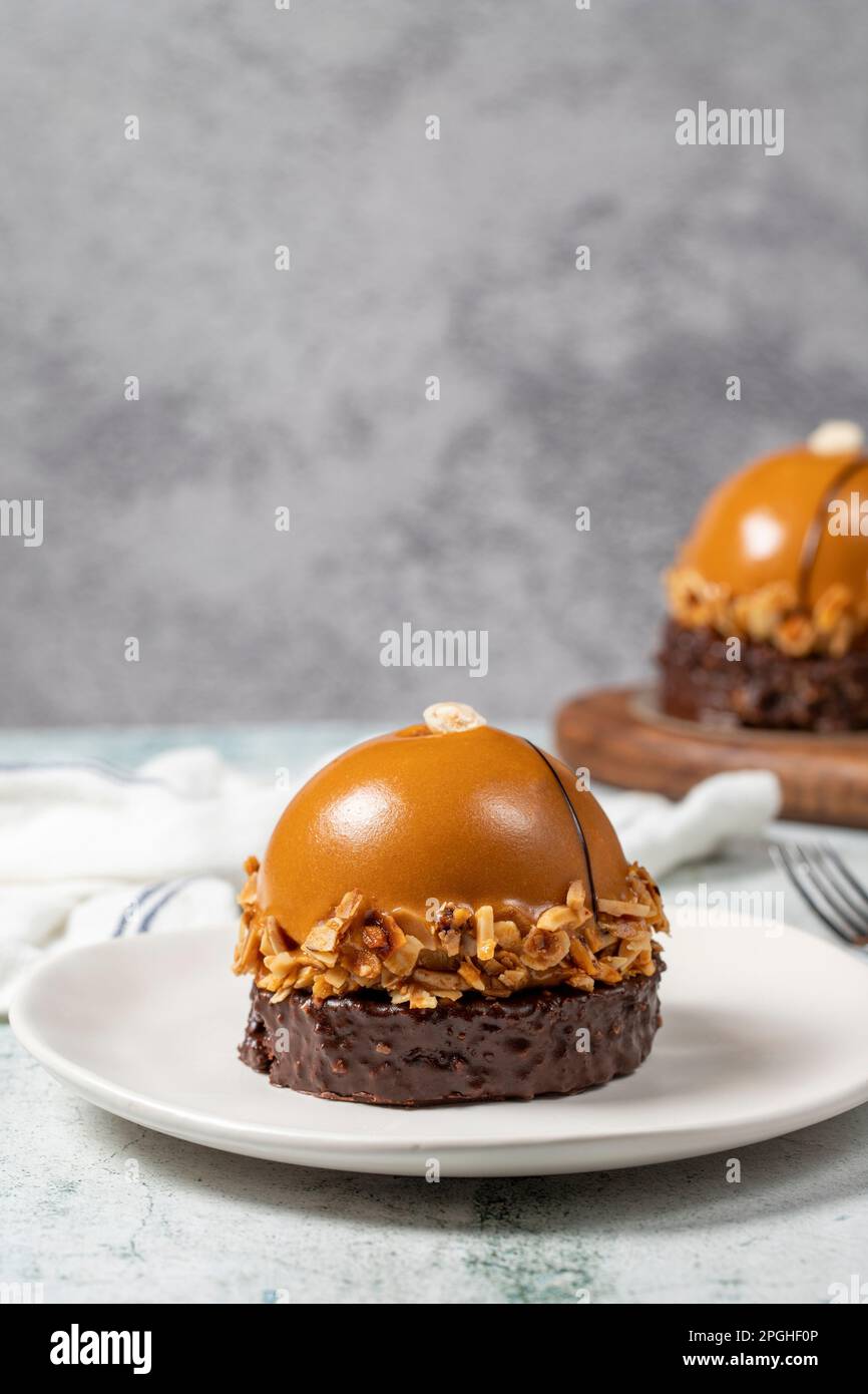 Round caramel cake. Hazelnut and cream portion cake Stock Photo - Alamy