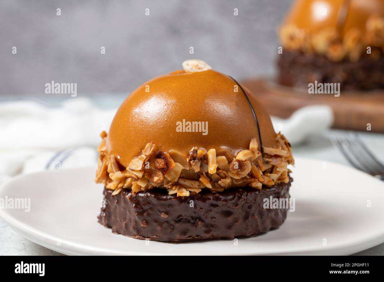 Round caramel cake. Hazelnut and cream portion cake. Close up Stock ...