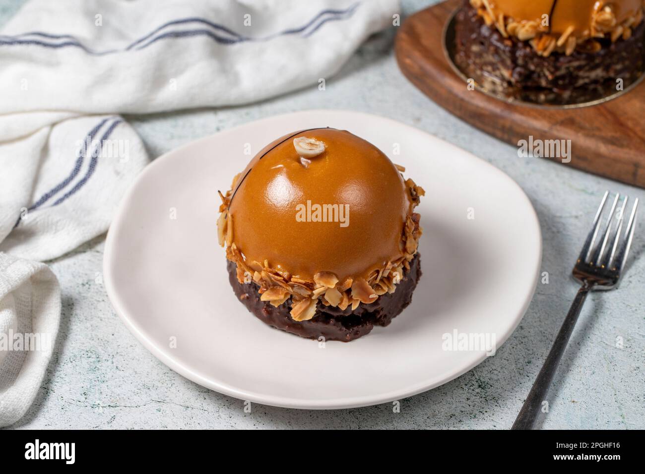 Round caramel cake. Hazelnut and cream portion cake Stock Photo - Alamy