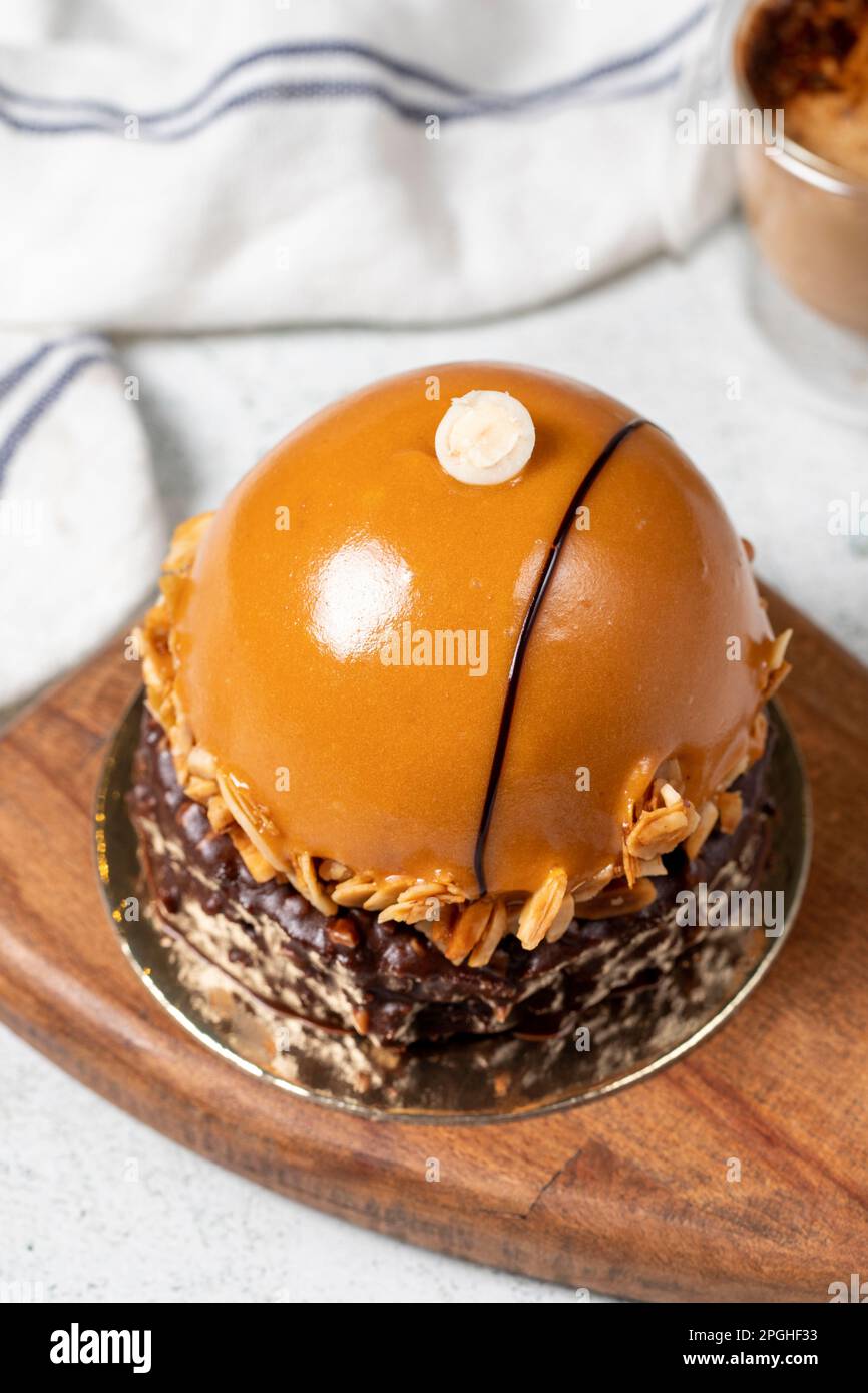Round caramel cake. Hazelnut and cream portion cake. Close up Stock ...