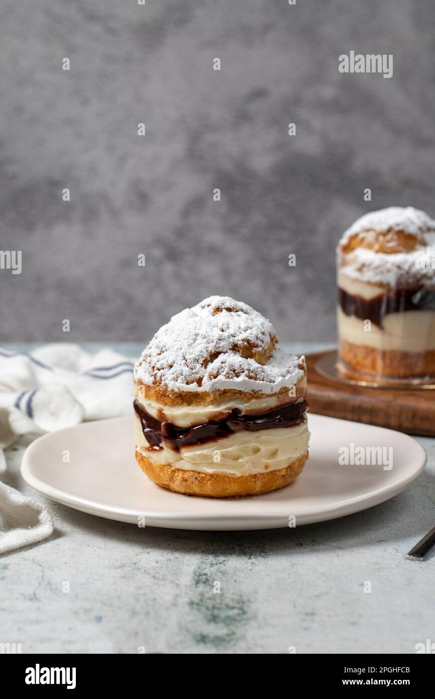 Cake with cream and liquid chocolate filling. Powdered Sugar Cake Stock ...