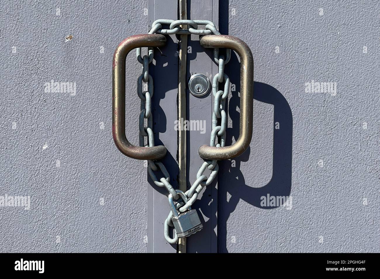 Padlock chain on reflections bar music lounge club door hi-res stock ...