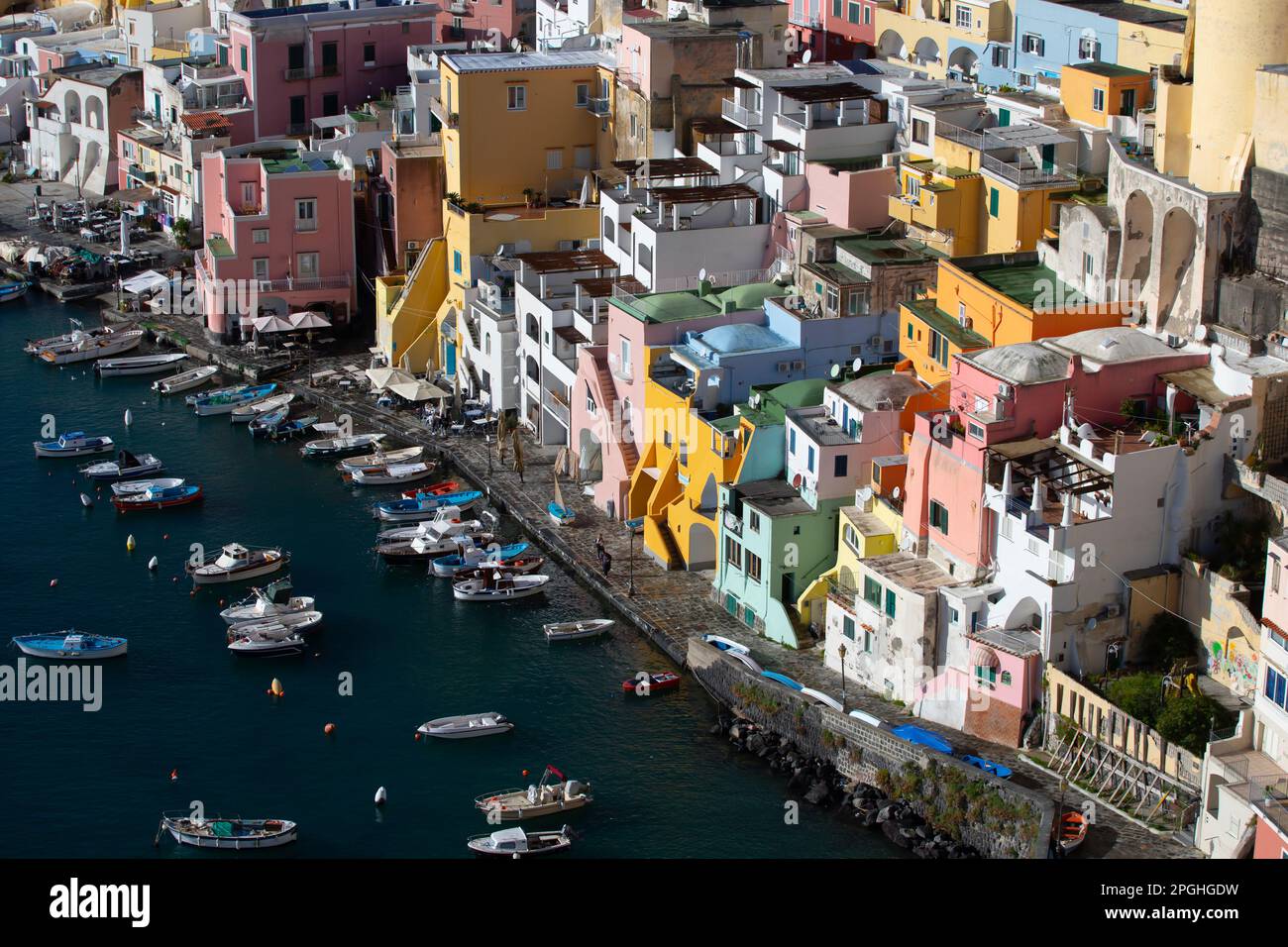View of the Port of Corricella with lots of colorful houses on a sunny ...