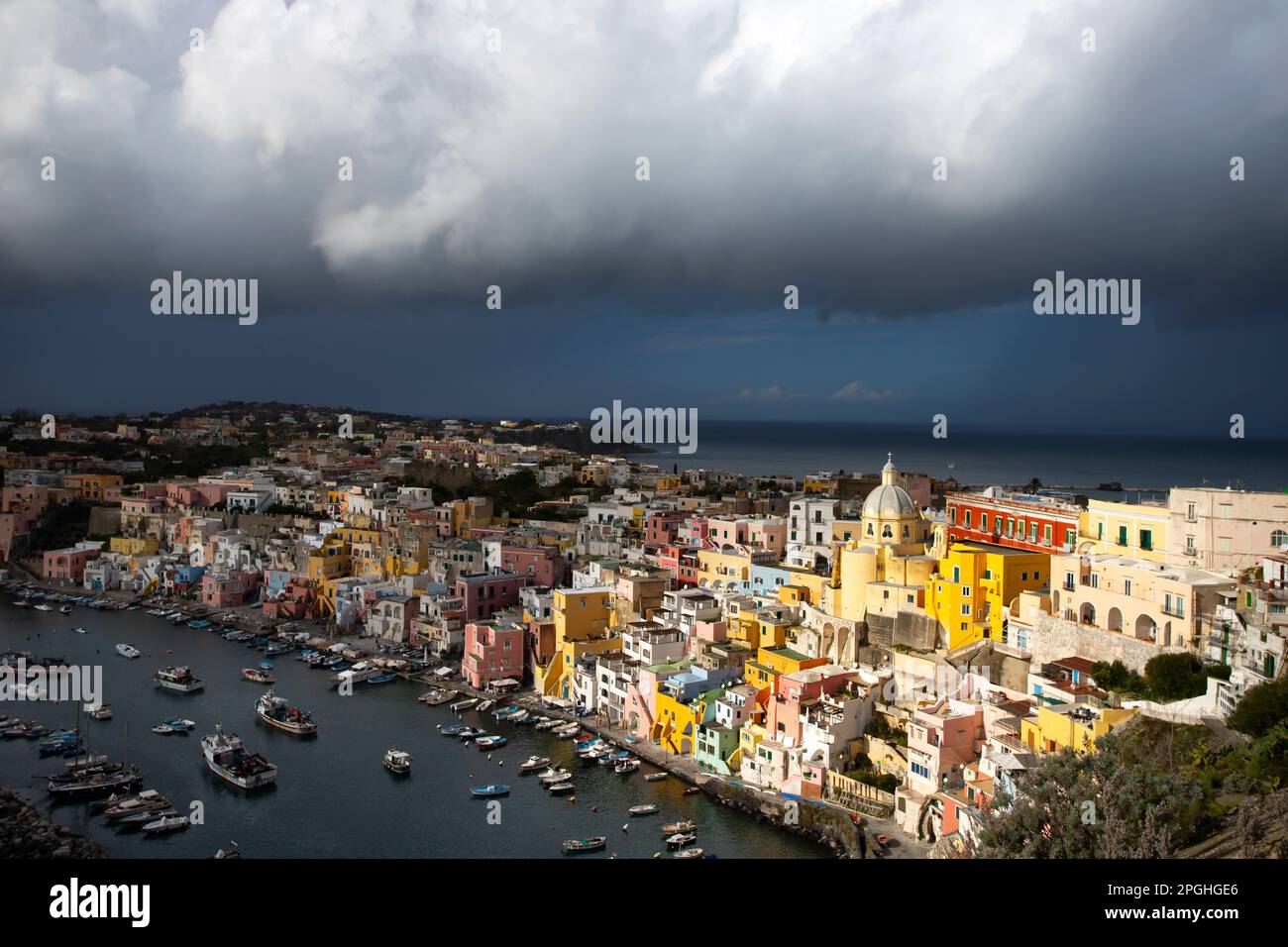 View of the Port of Corricella with lots of colorful houses on a sunny ...