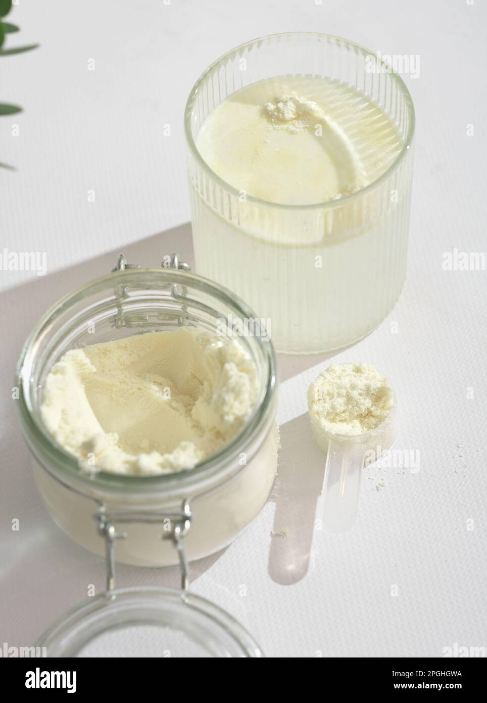 scoop of fish collagen. collagen peptides in glass jar. powder for ...