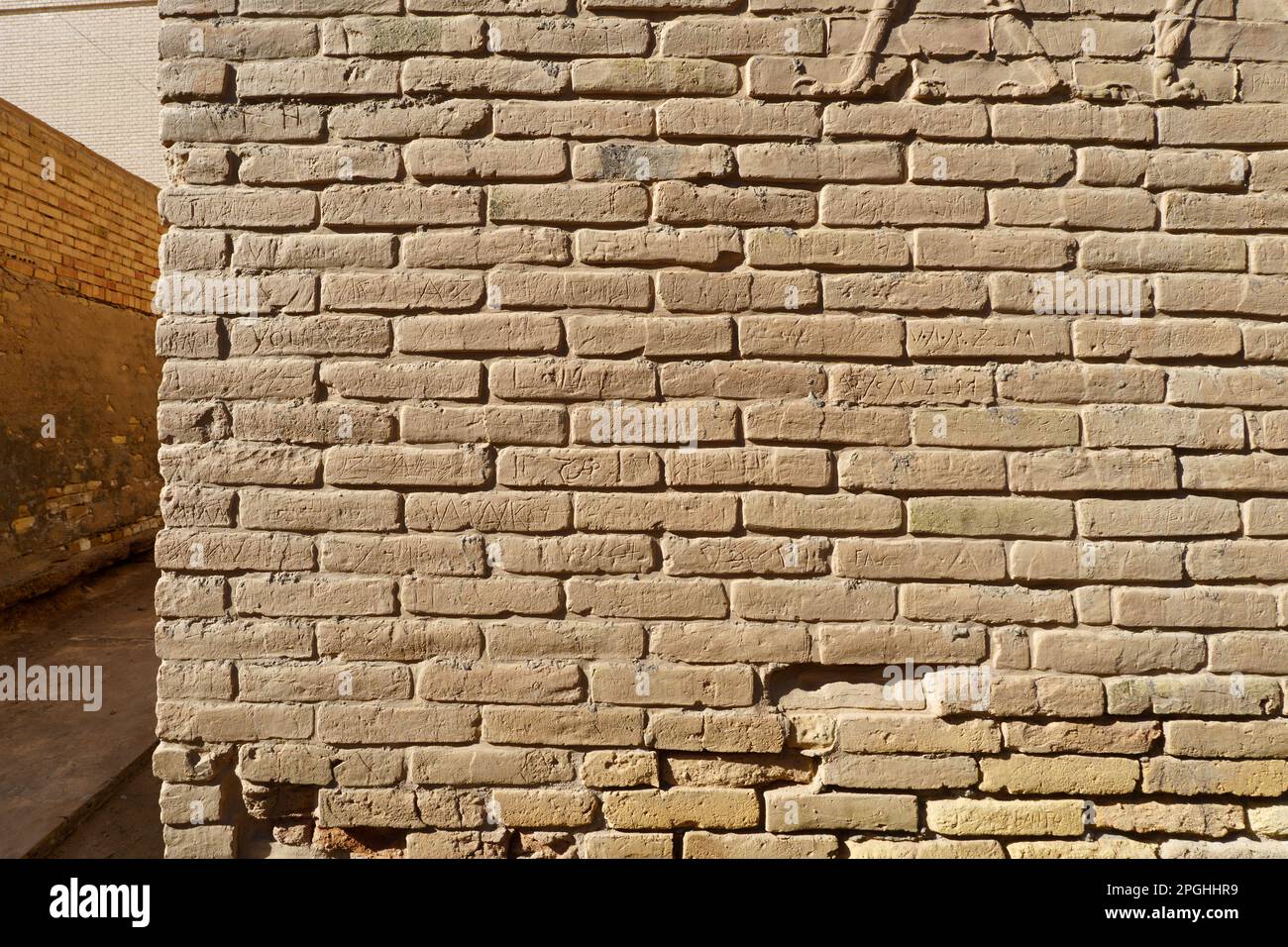 Landscape Close-up View of a Brick Wall with Cuneiform Script Engraved ...