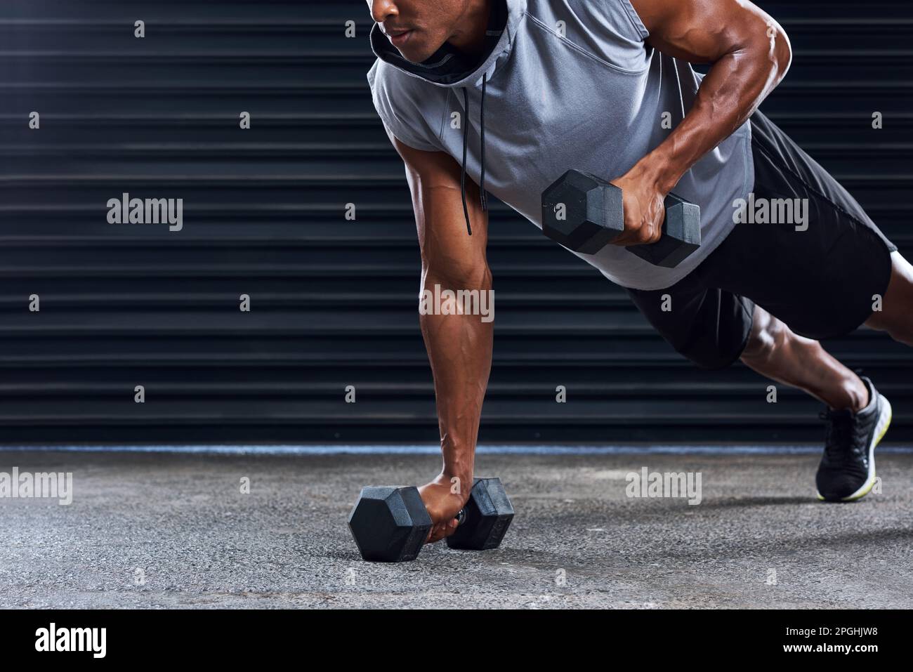 Youll get there sooner than you think. a sporty young man working out ...