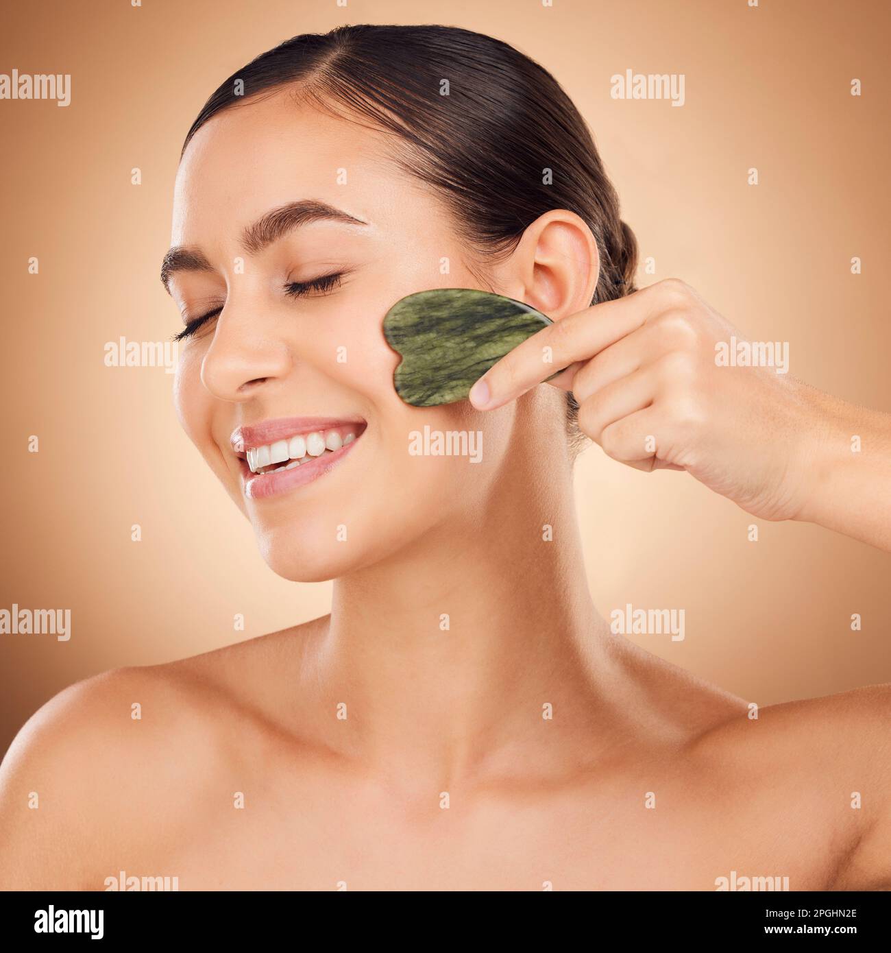 Skincare, gua sha stone and woman face cleaning of a young person with ...